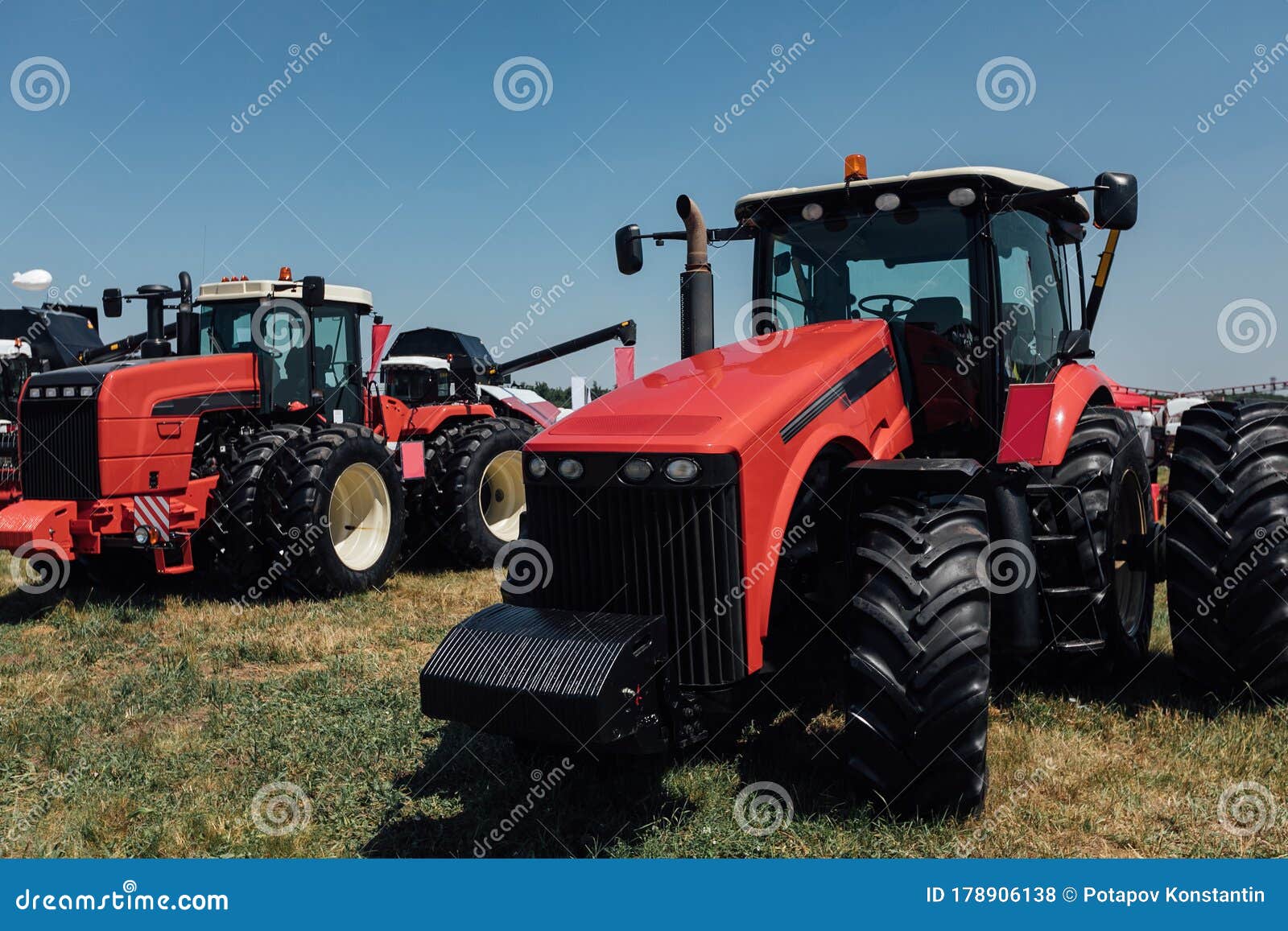 Red Tractor with Large Wheels in the Field during Tests during the ...