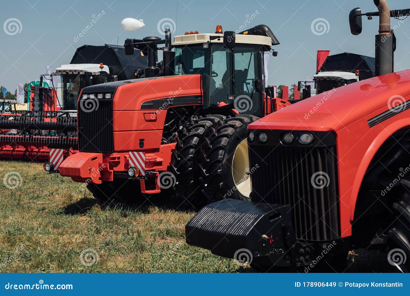 Red Tractor with Large Wheels in the Field during Tests during the ...