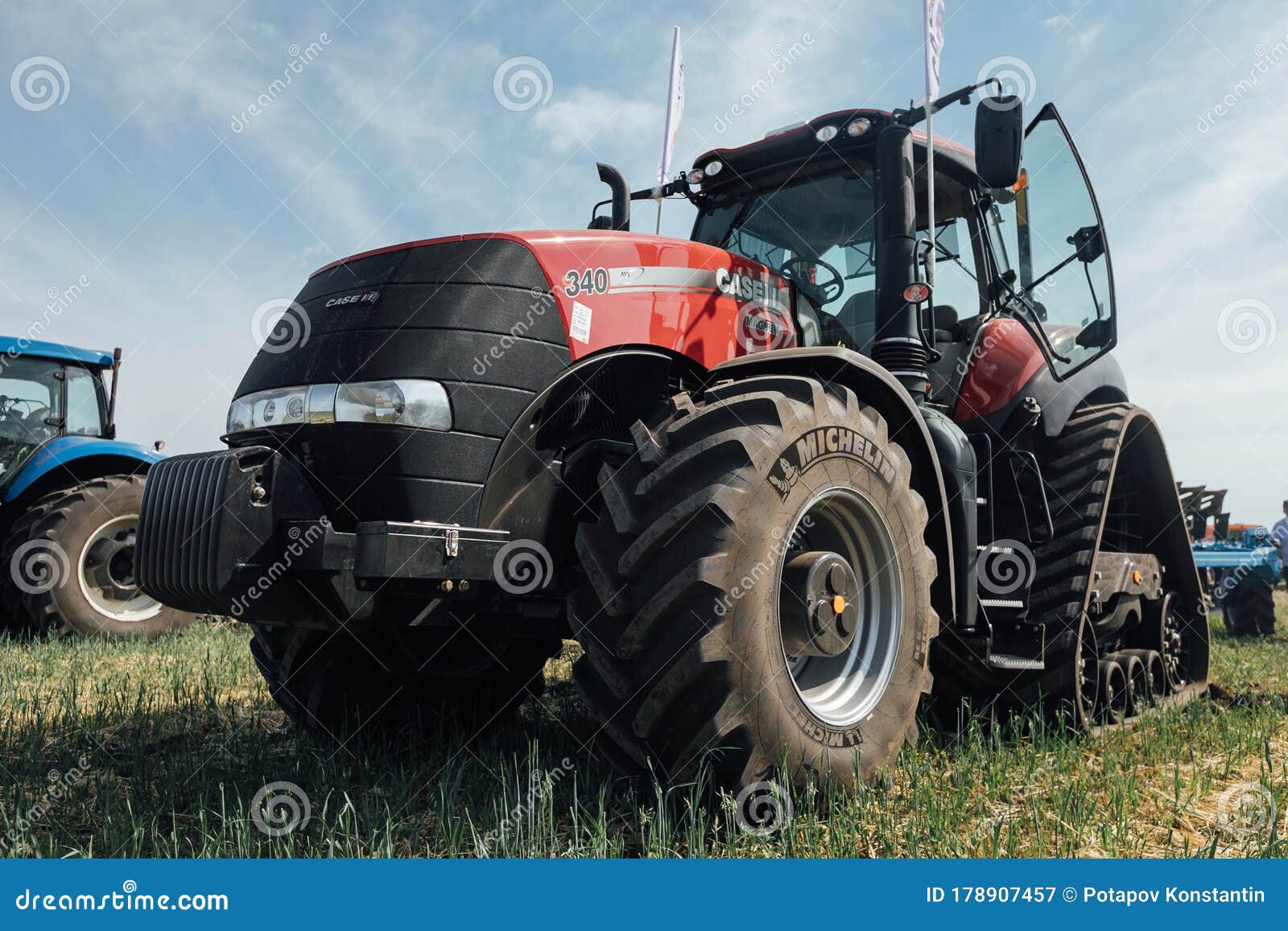 Red Tractor with Large Wheels in the Field during Tests during the ...