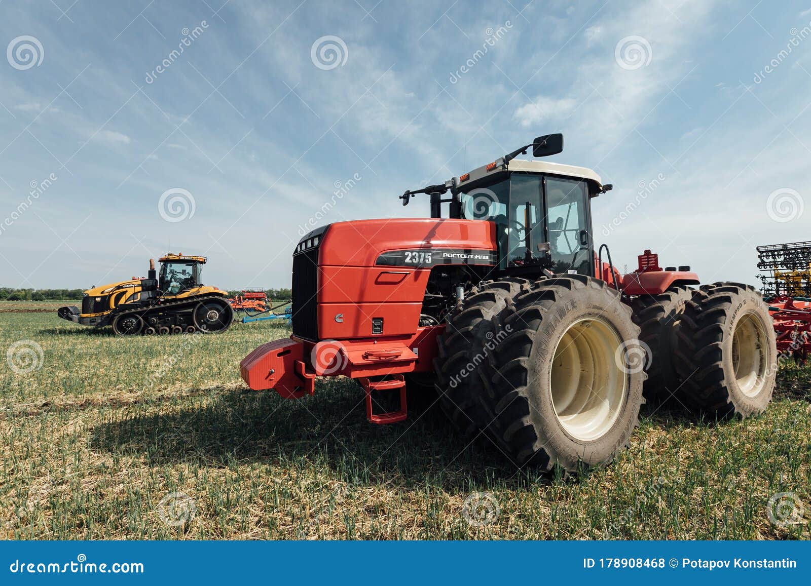 Red Tractor with Large Wheels in the Field during Tests during the ...