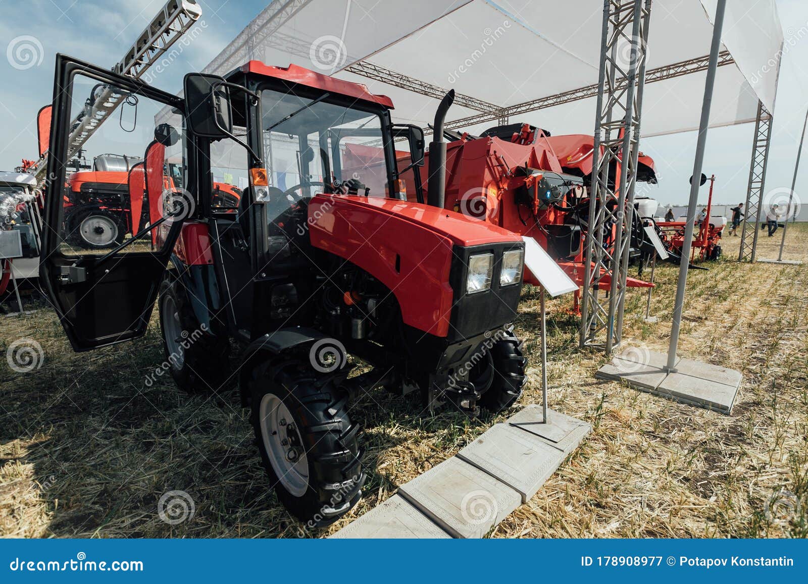 Red Tractor with Large Wheels in the Field during Tests during the ...