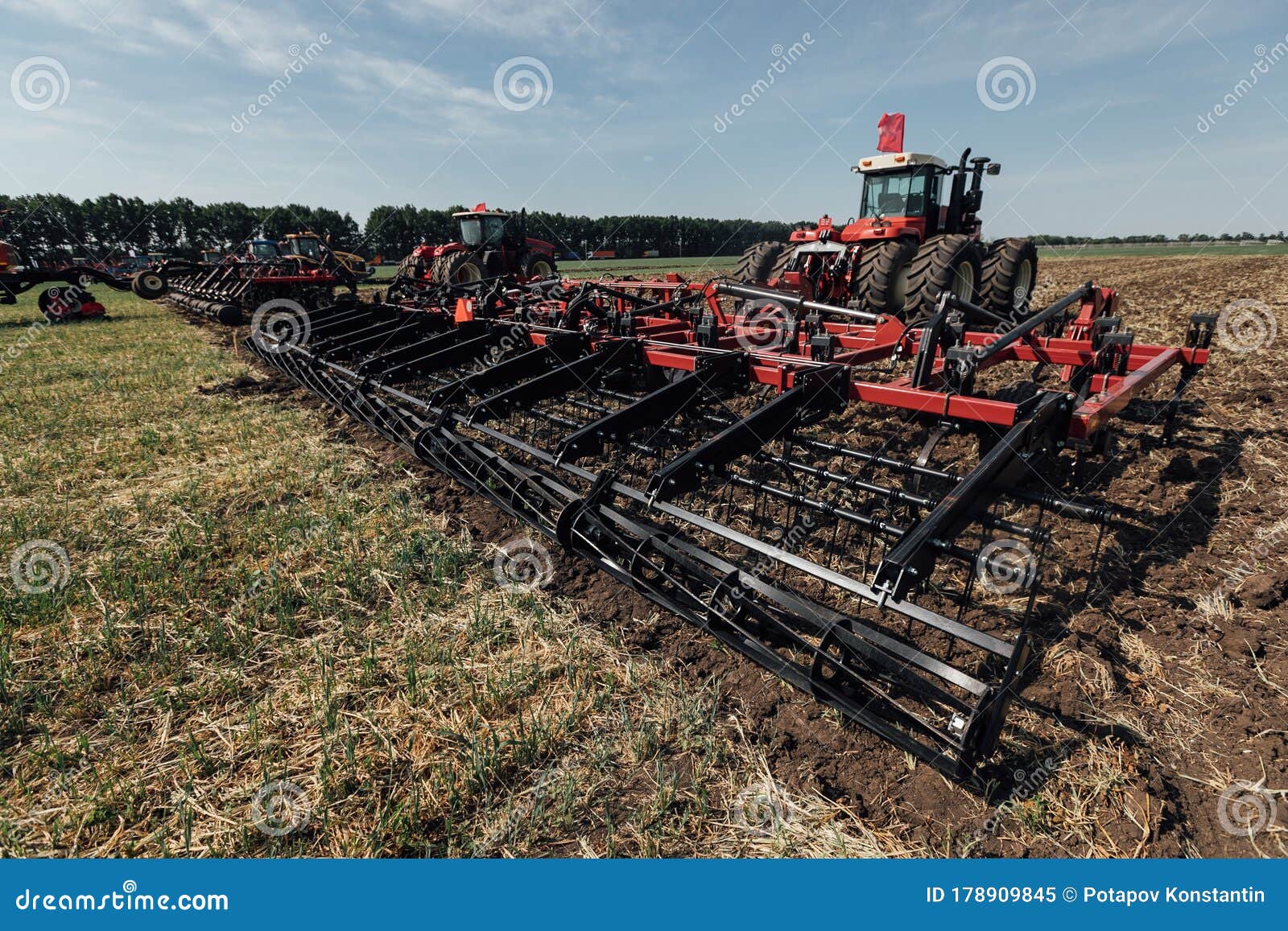 Red Tractor with a Plant for Tillage during Summer Plowing Stock Image ...