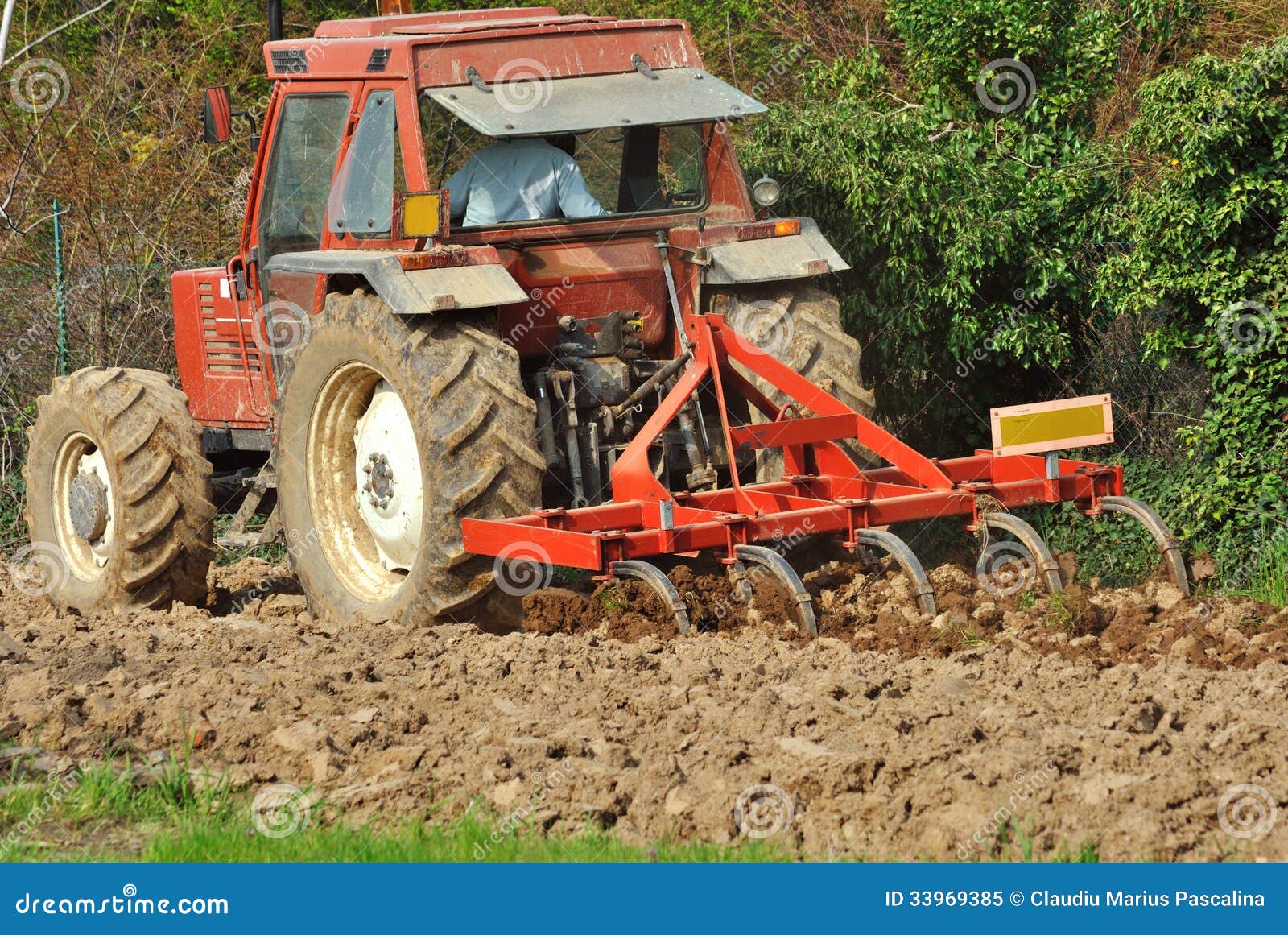 Red tractor at work stock image. Image of field, fields - 33969385
