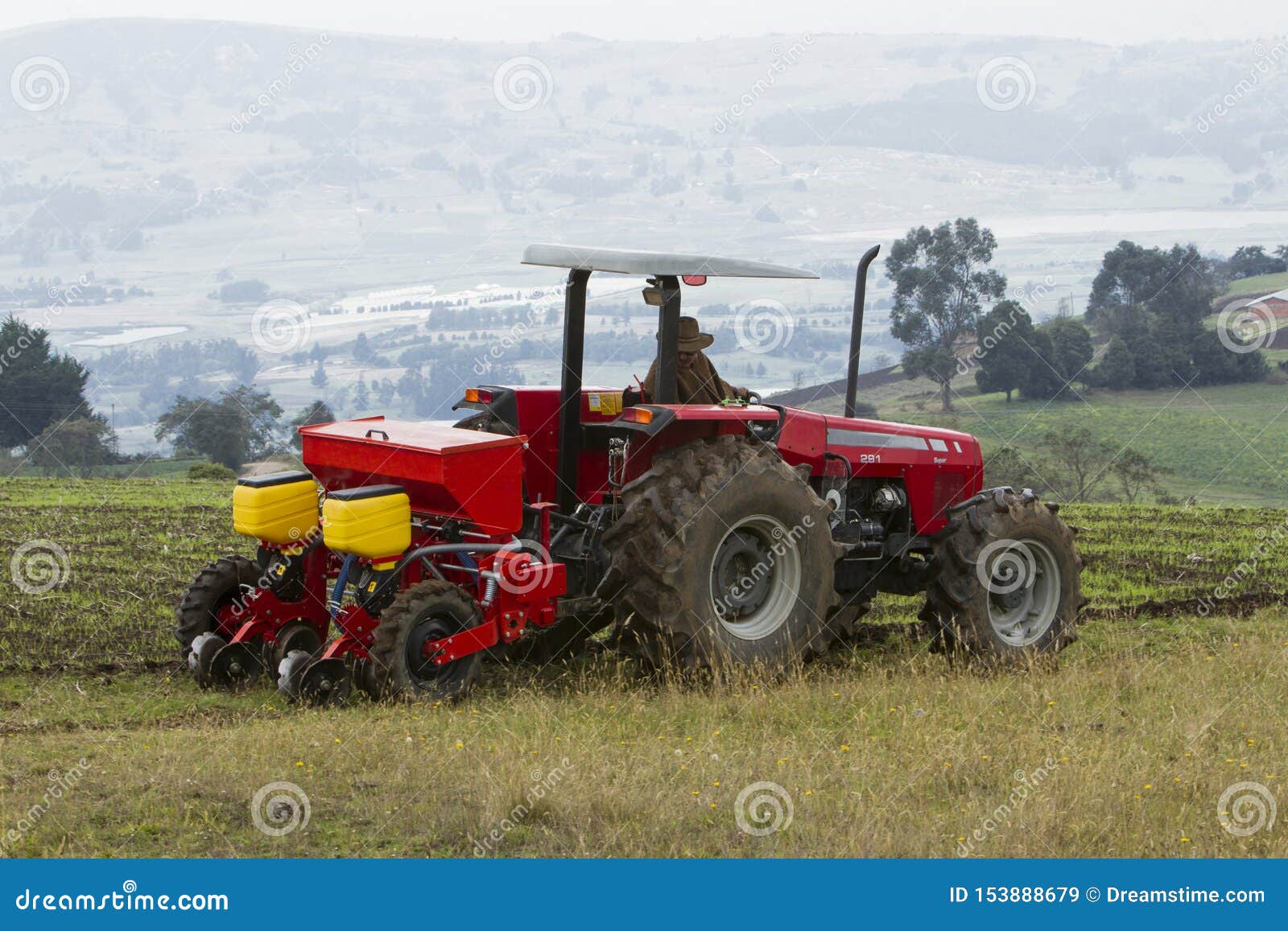 Red Tractor Working on Field Stock Image - Image of moountains, blue ...