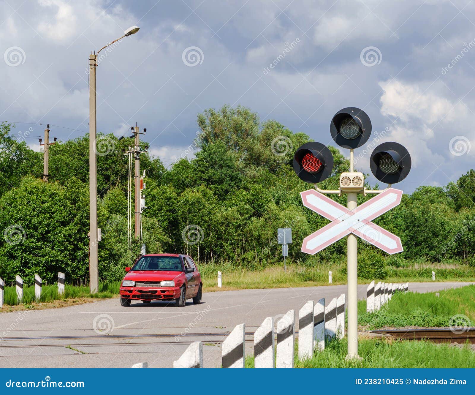 Red Traffic Light at the Railway Crossing. Car in Front of a Railway ...