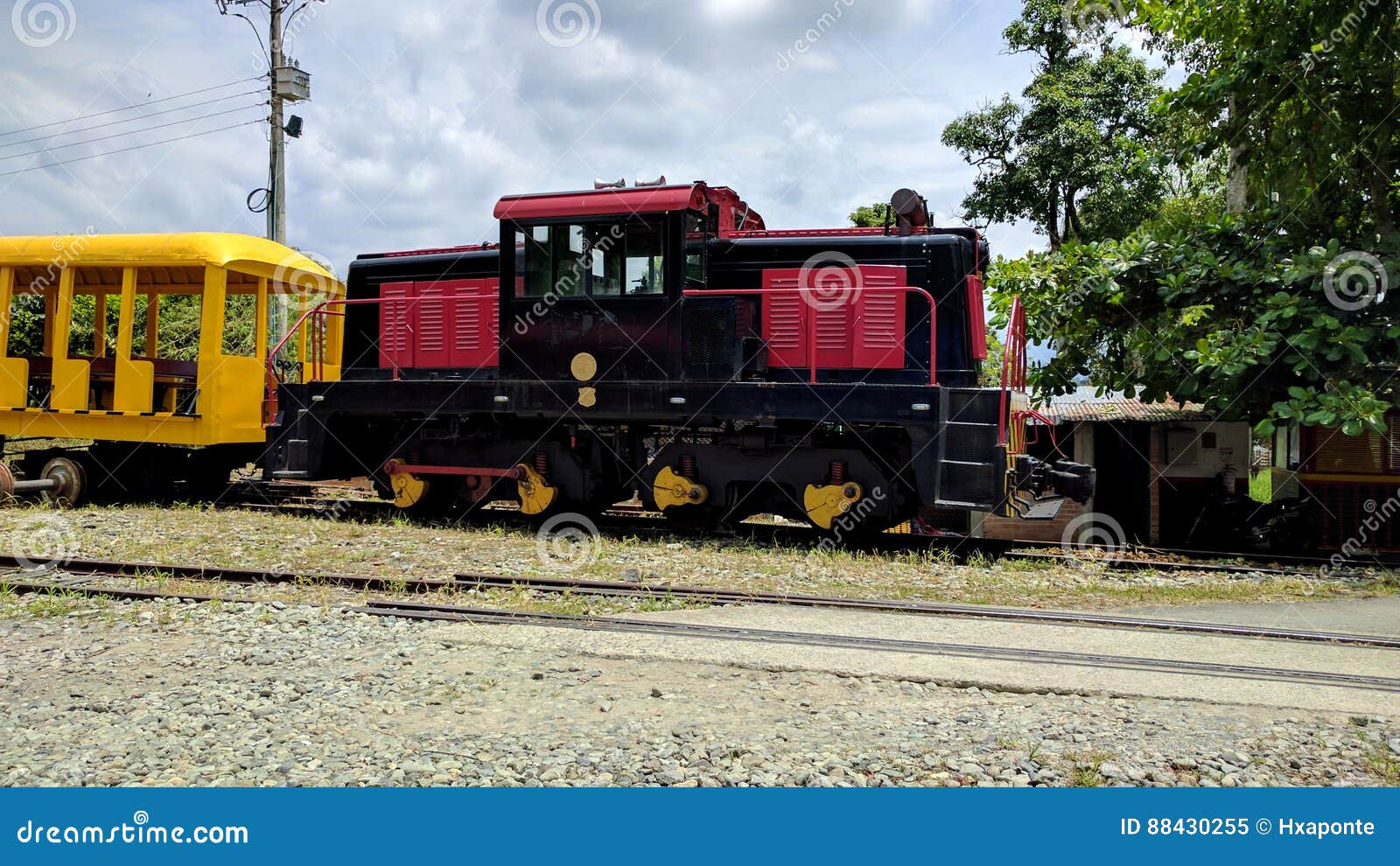 Red Train Engine Towing a Yellow Train Car Stock Image - Image of black ...