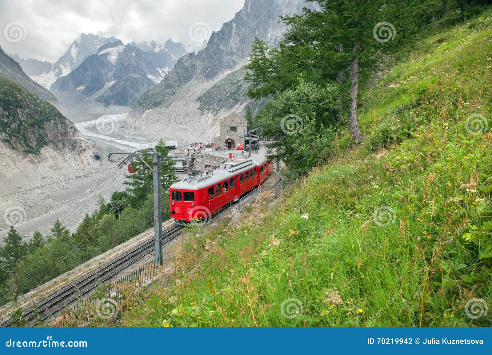 A red train in French Alps stock photo. Image of place - 70219942