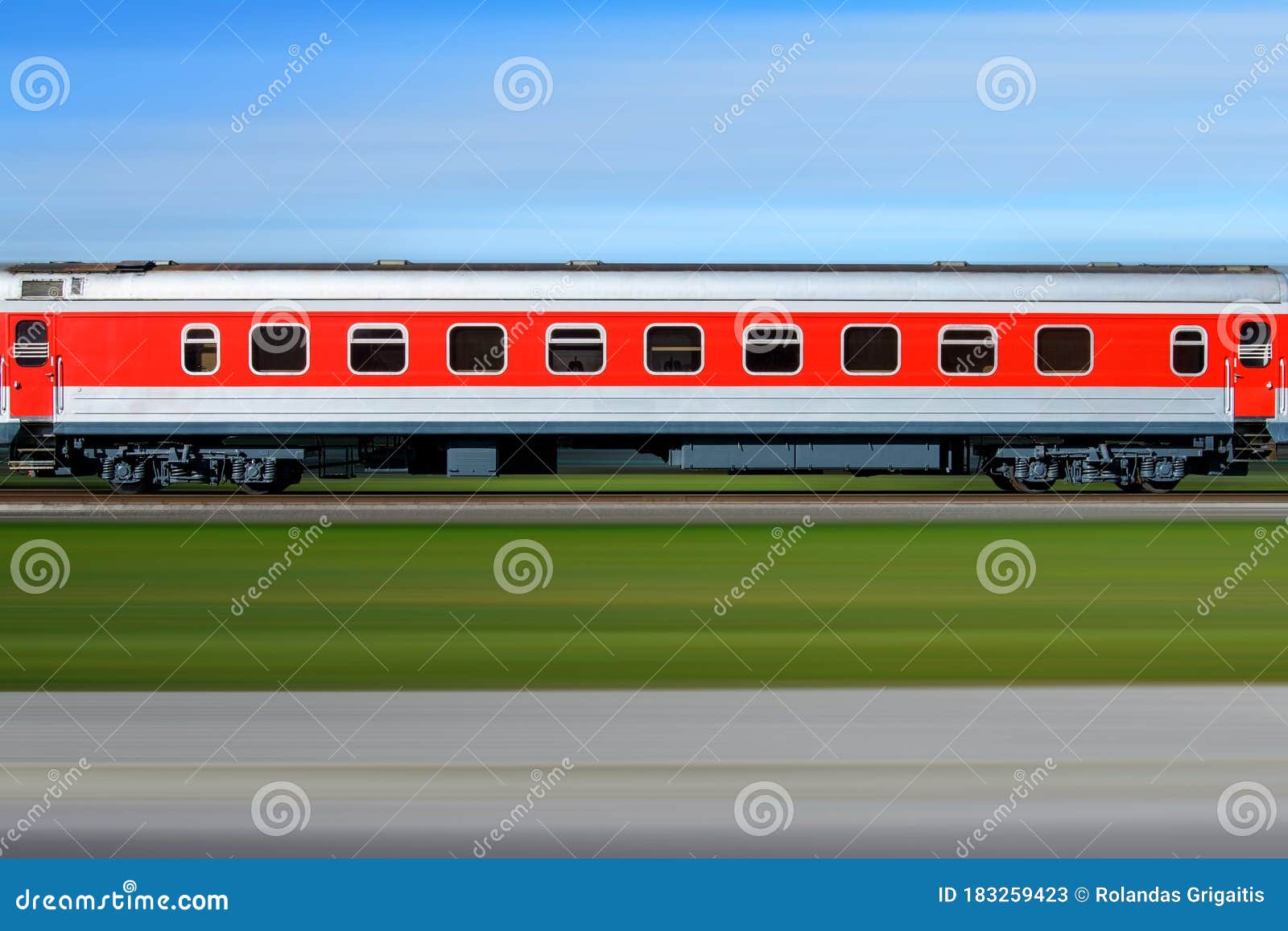 Red Train in Motion. Side View of the Moving Train Runs on Railway in ...