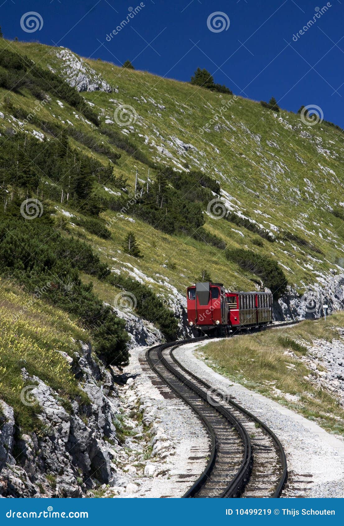 Red train in the mountains stock image. Image of scenery - 10499219