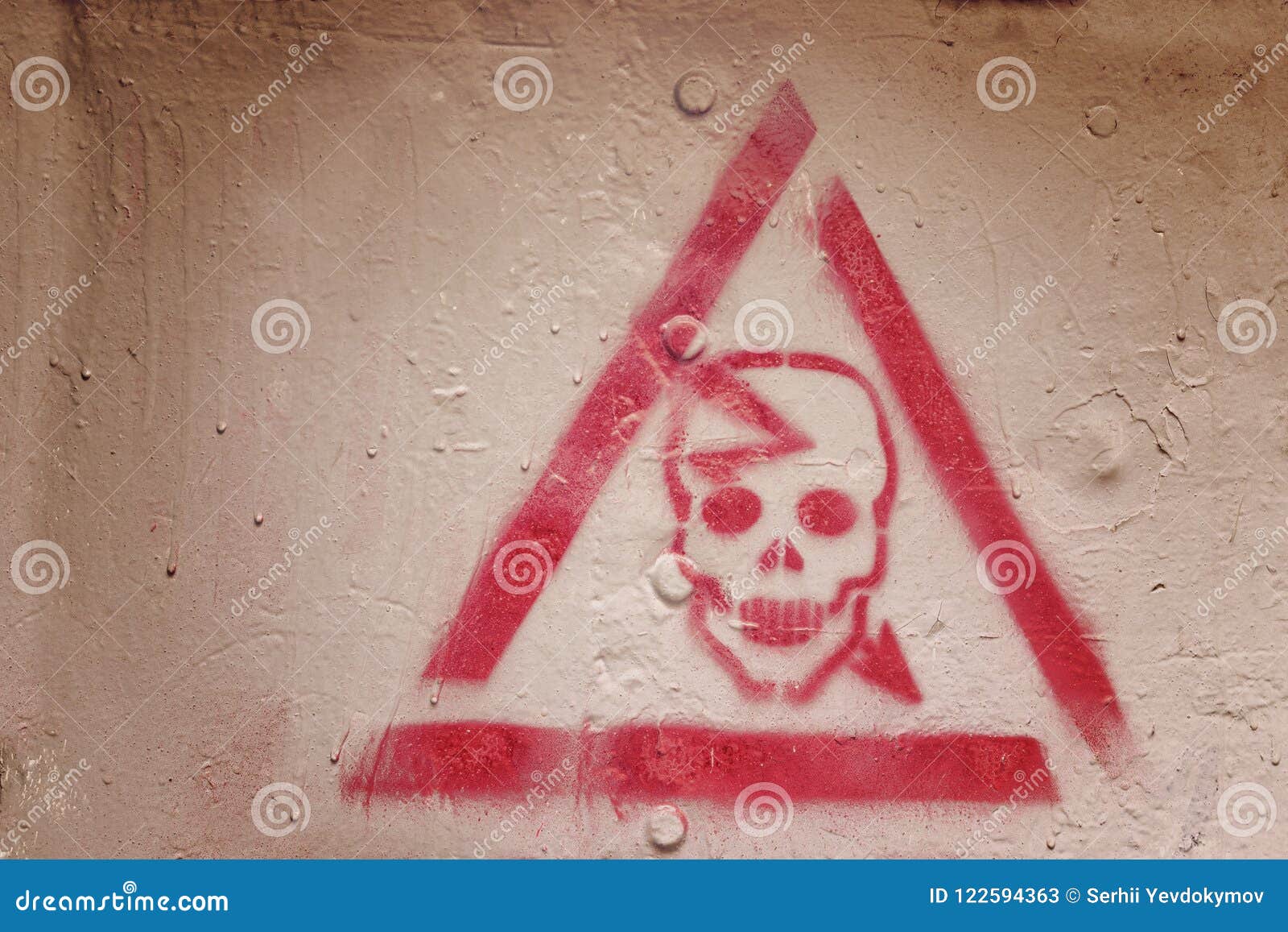 Red Triangle with a Skull. Danger Sign Painted on the Wall Stock Image ...