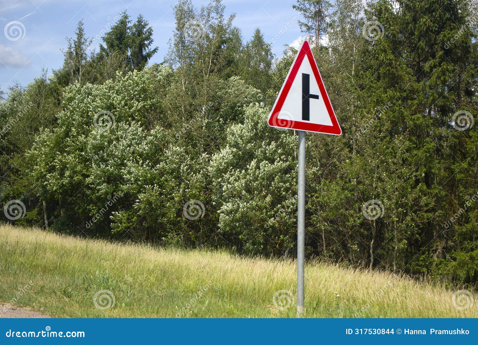 Red Triangular Road Sign Meaning a Side Road Junction on the Right ...