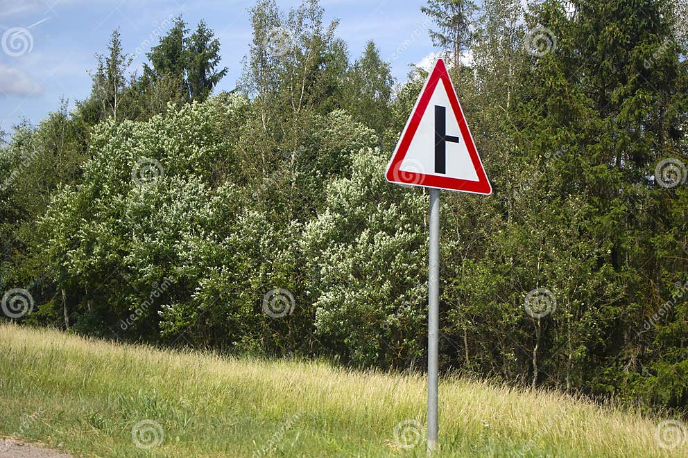 Red Triangular Road Sign Meaning a Side Road Junction on the Right ...