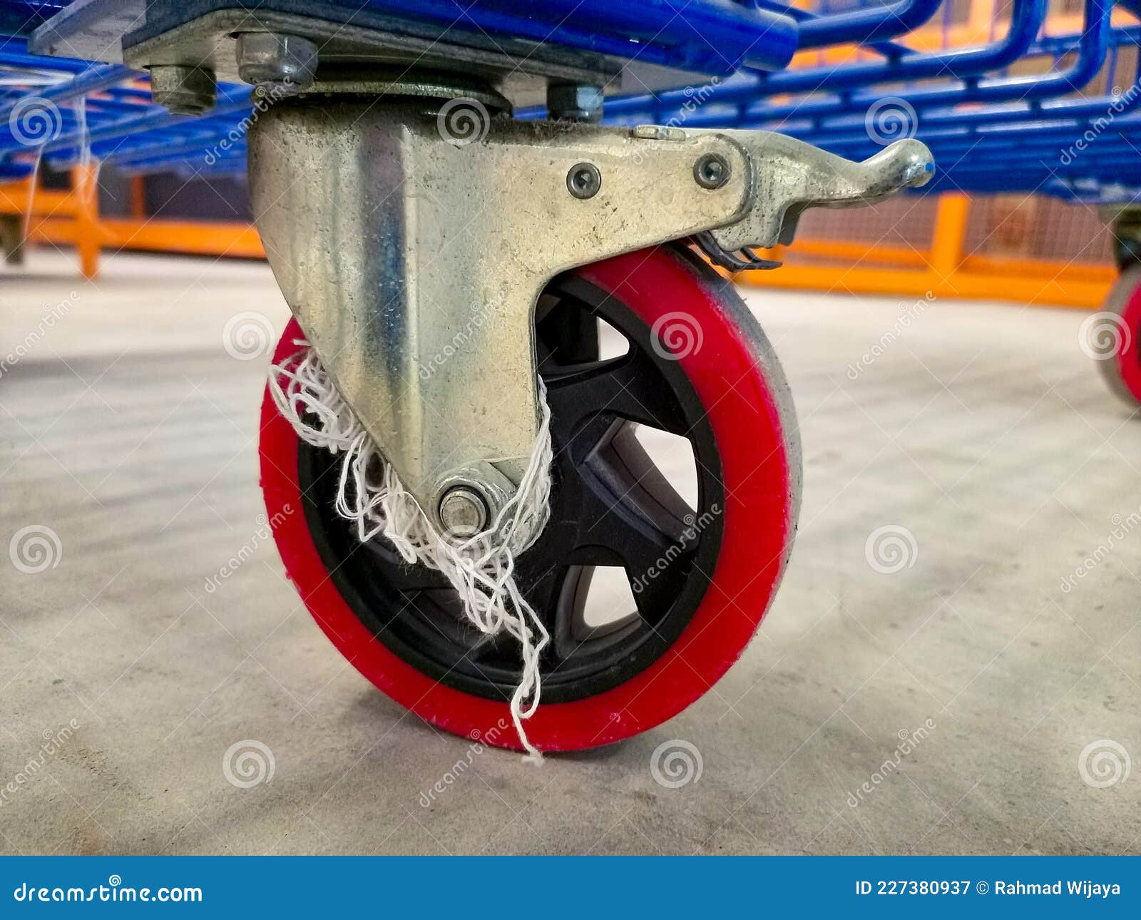Red Trolley Wheel with Thread Stuck in Thmd Warehousing Area Stock ...