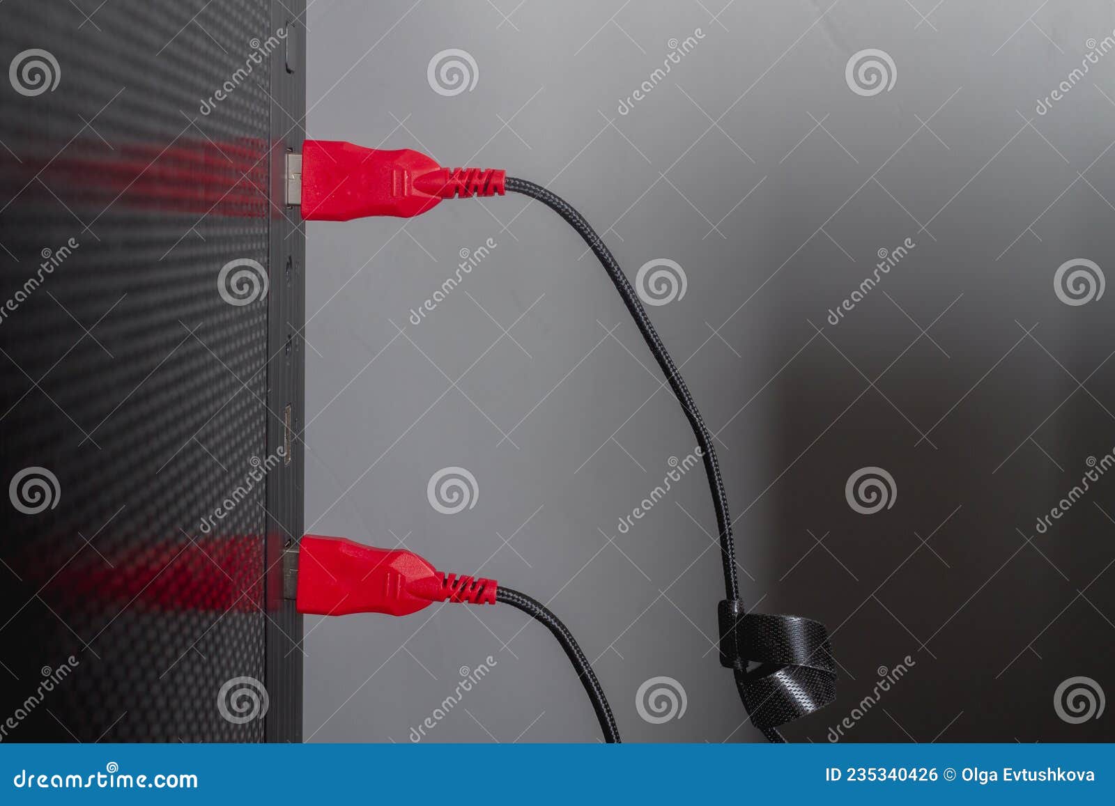 The Red USB Cord is Inserted into the USB Port of the Computer Stock ...