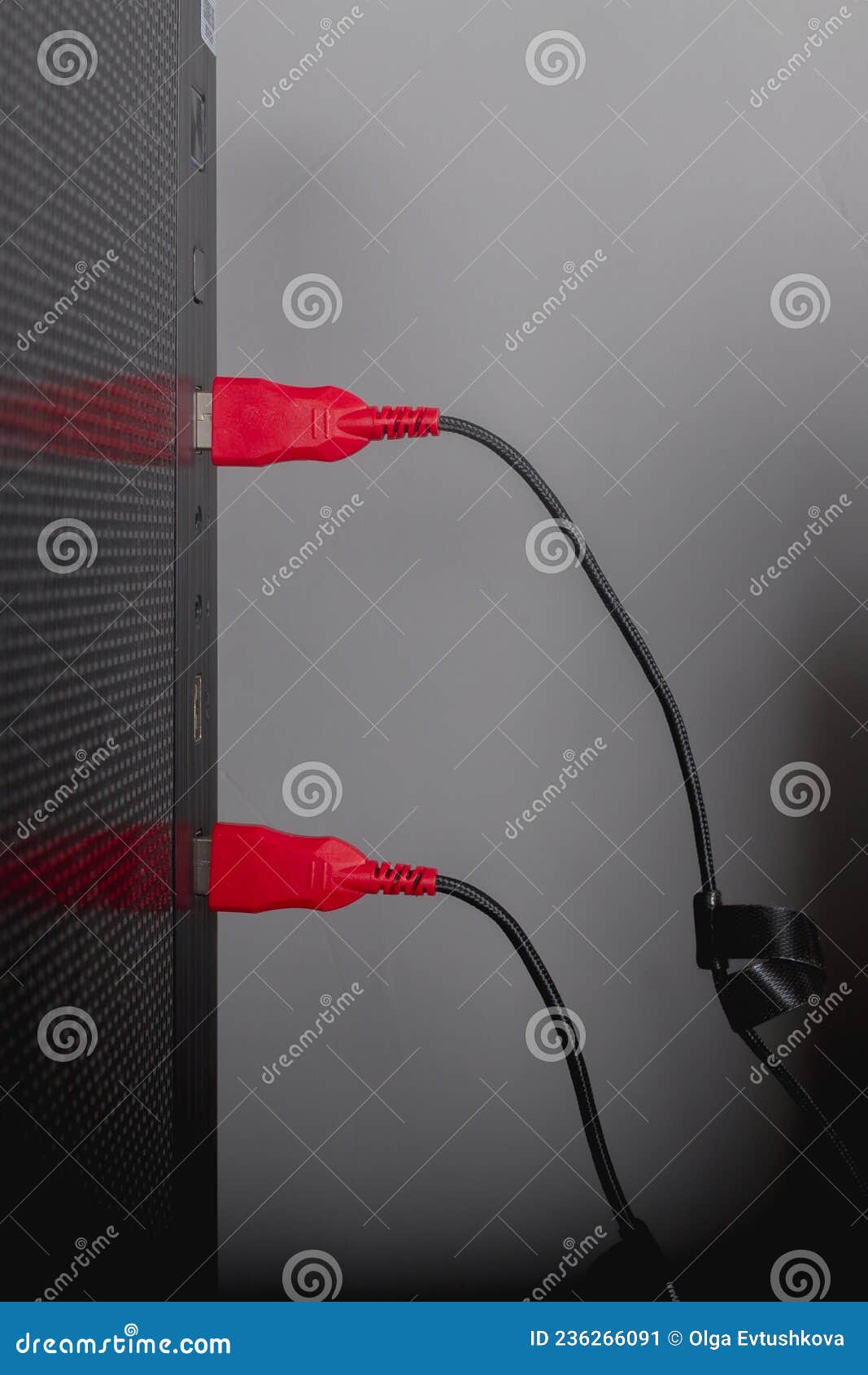 The Red USB Cord is Inserted into the USB Port of the Computer Stock ...