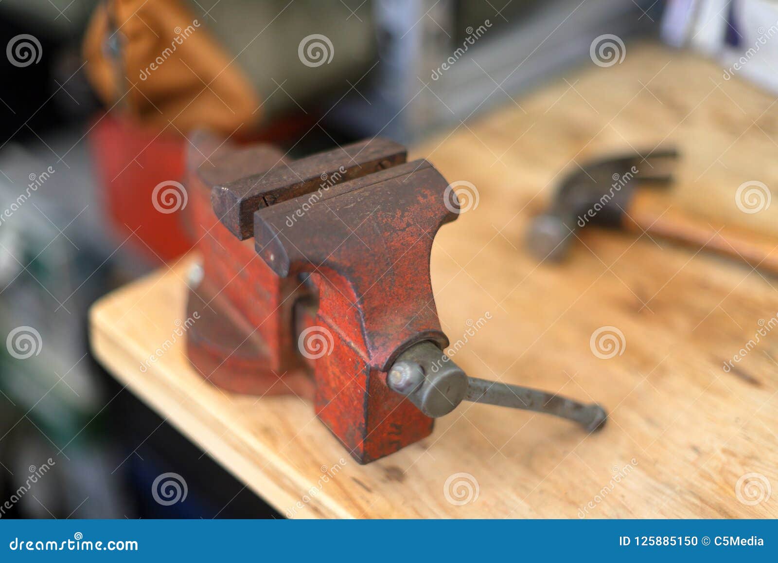Red Vise on Work Bench with Hammer Stock Photo - Image of construction ...