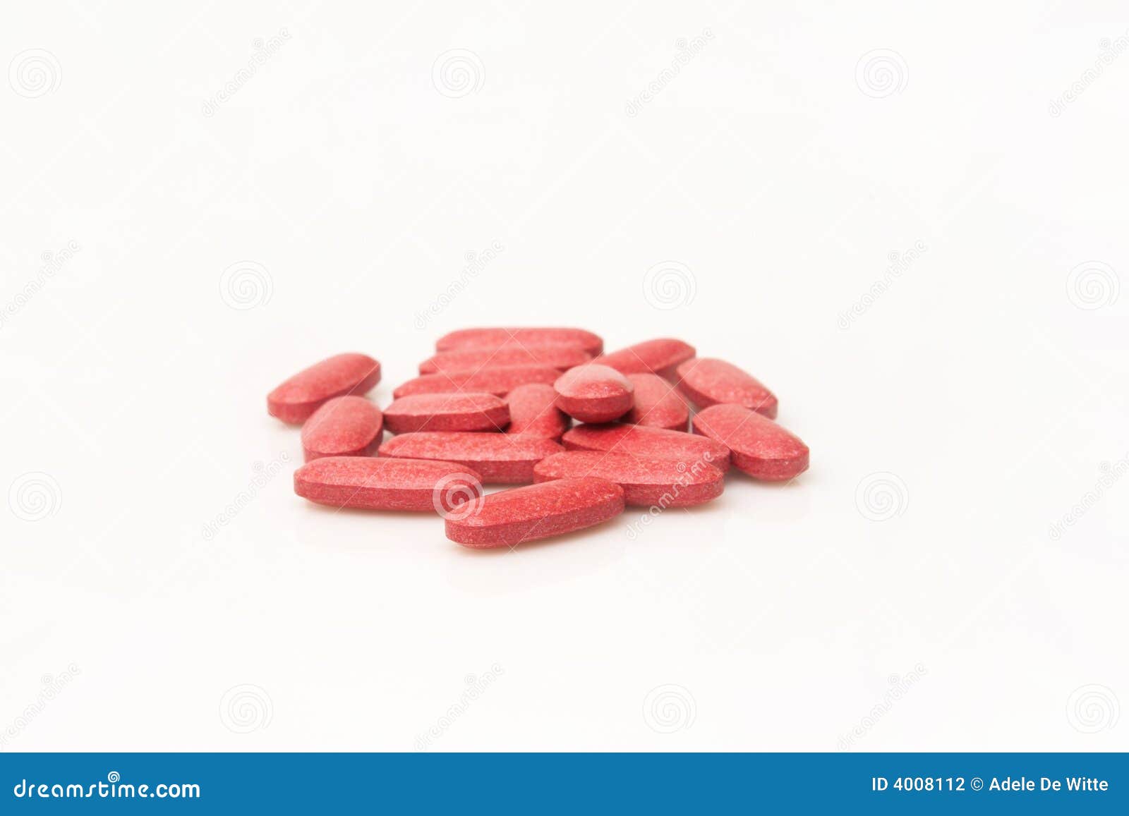 Red Vitamin Tablets on a White Surface Stock Photo - Image of medicinal ...
