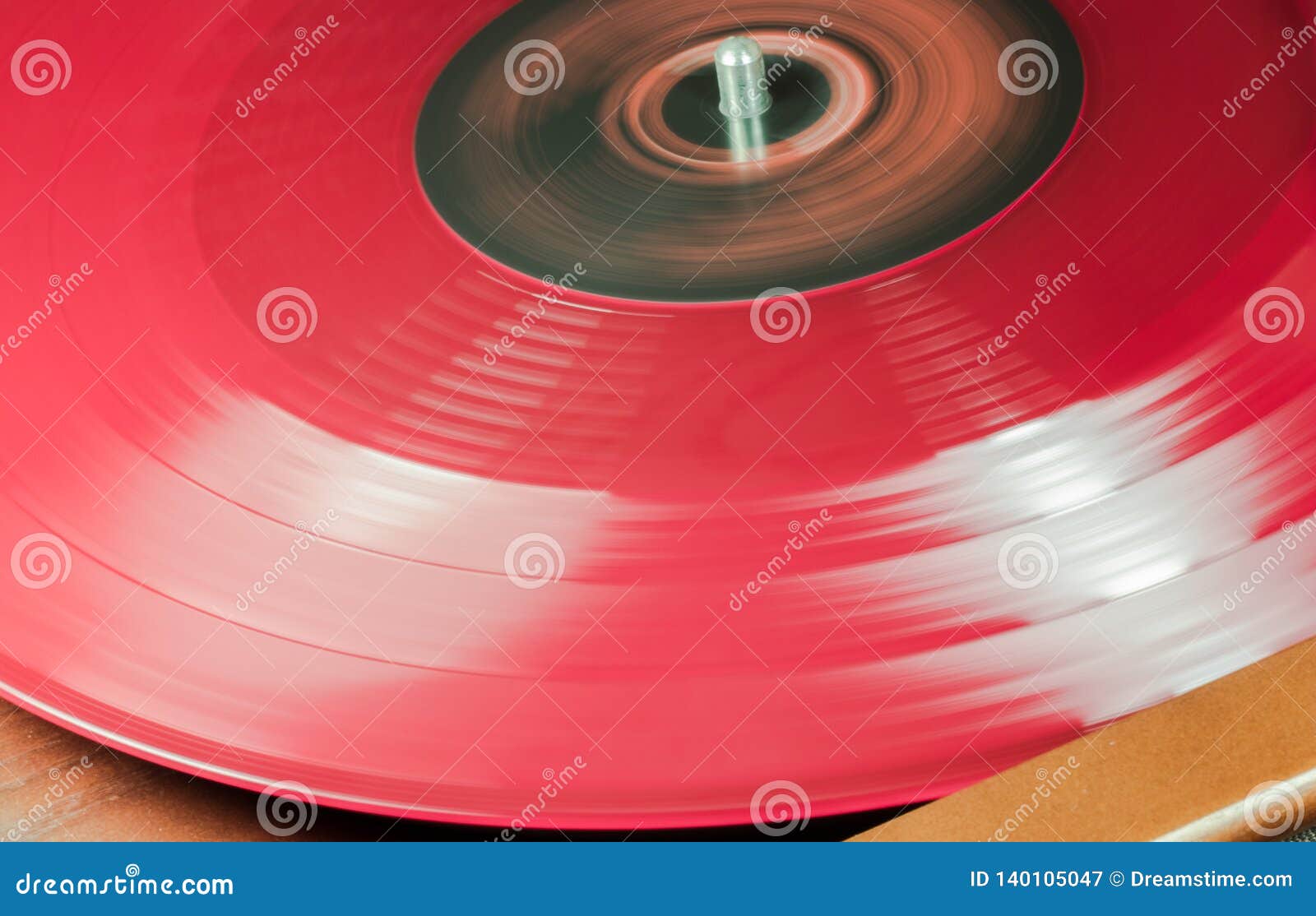 A Red Vynil Disc is Being Played in a Player Stock Image - Image of ...