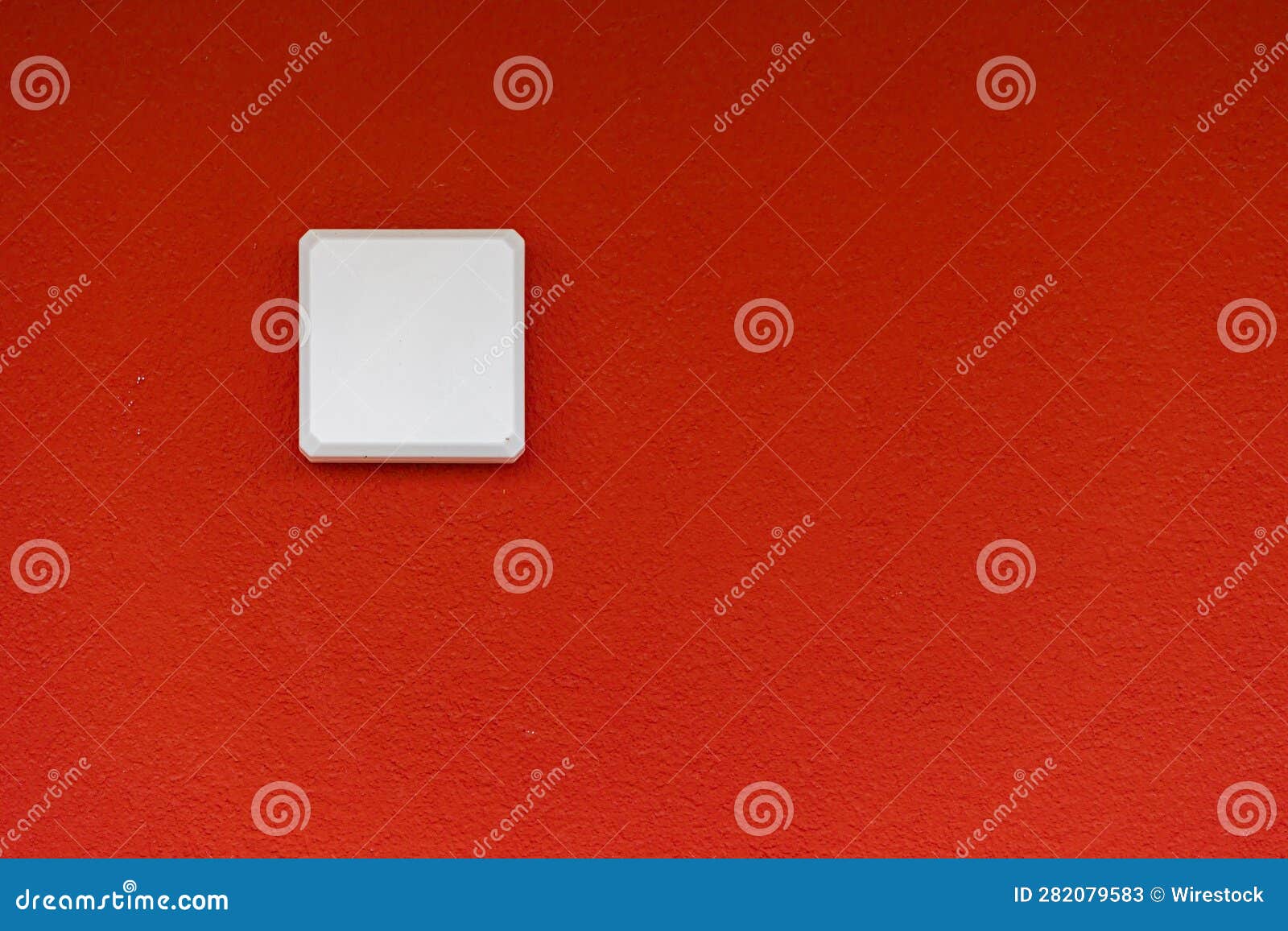 A Red Wall with a White Square Light Switch on it Stock Image - Image ...