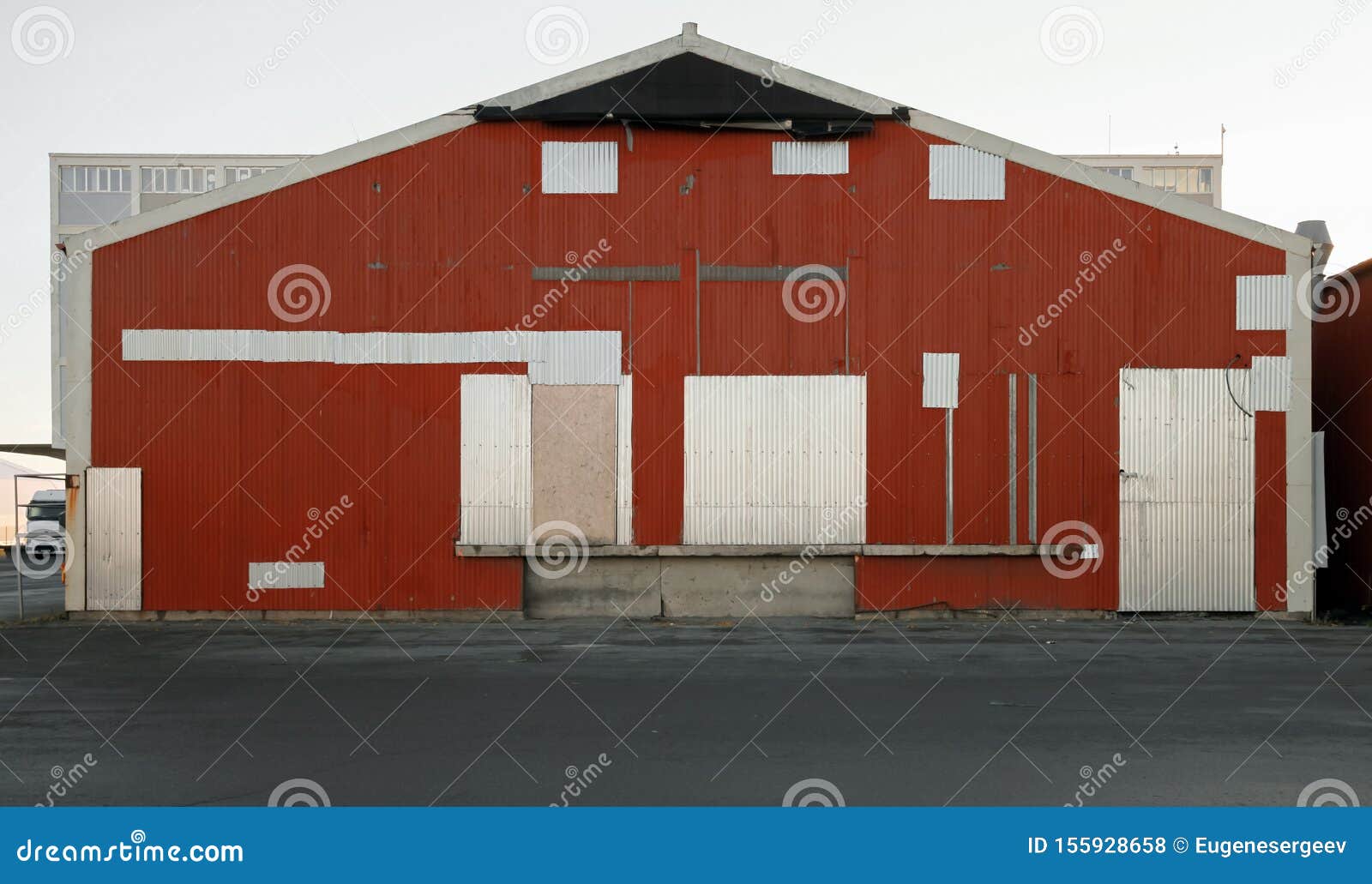 Red Warehouse Wall with Closed Gates Stock Photo - Image of garage ...