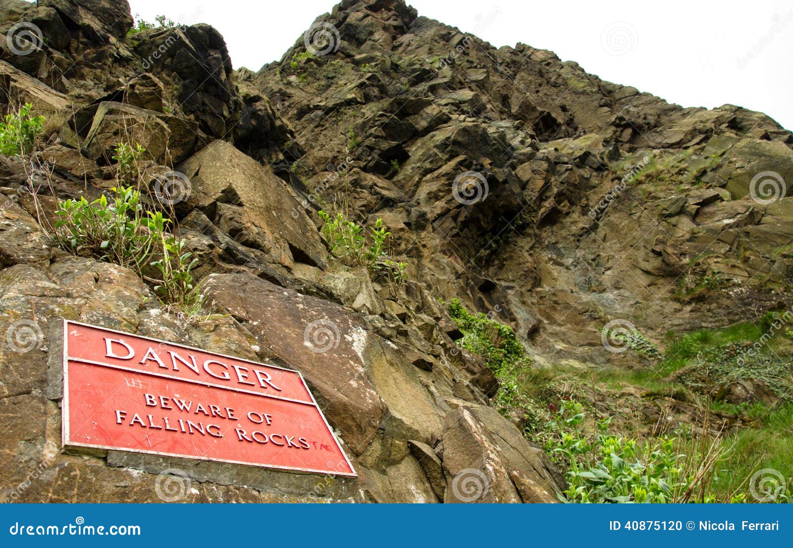 Red Warning Sign for Falling Rocks on a Cliffs in Edinburgh, Scotland ...