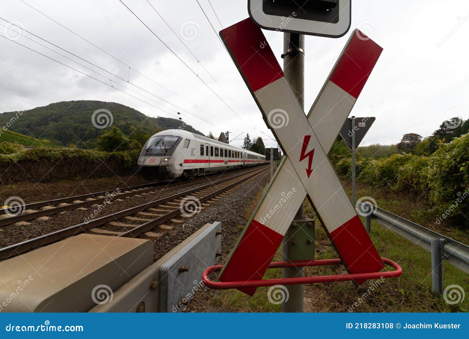 A Red Warning Sign with a Passenger Train in Background Stock Photo ...