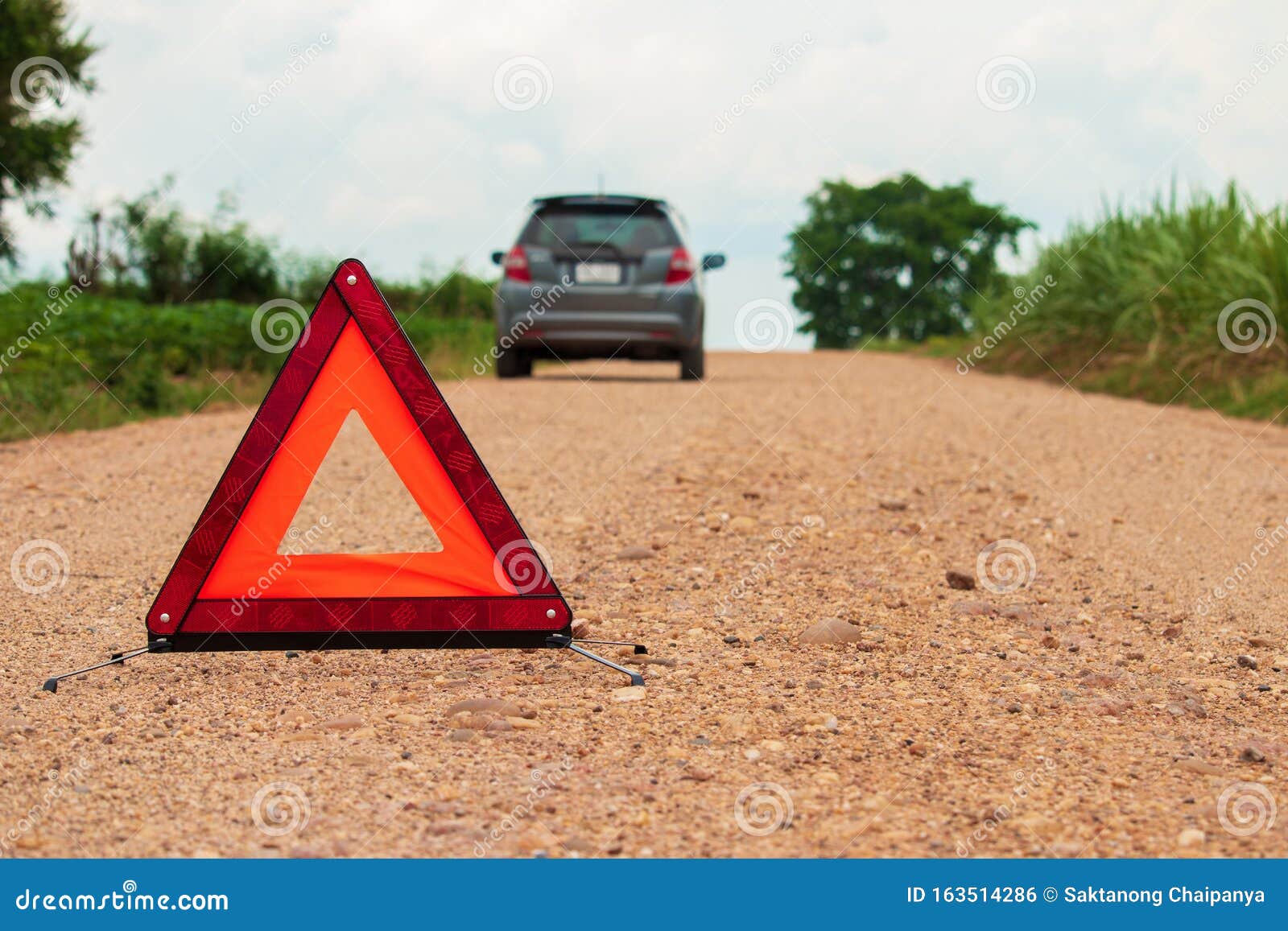 Red Warning Triangle. Focus on Red Triangle!, beside Rural Road Stock ...