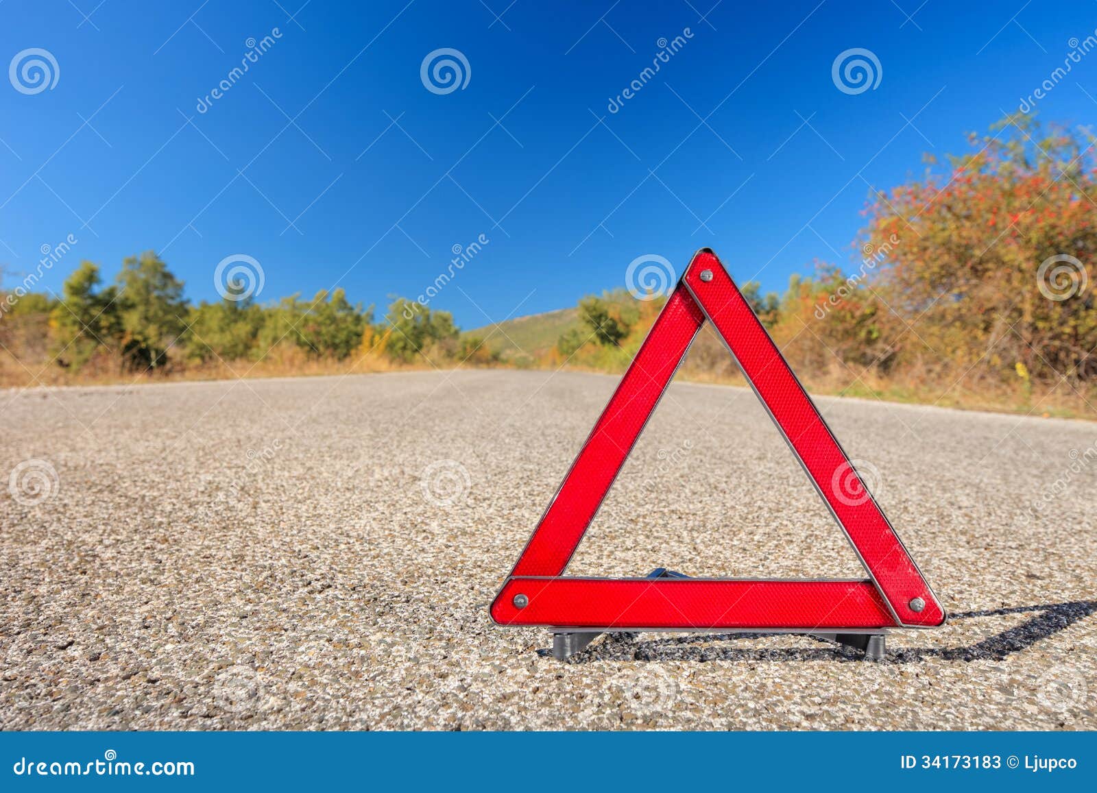 Red Warning Triangle on a Road Stock Image - Image of plastic ...