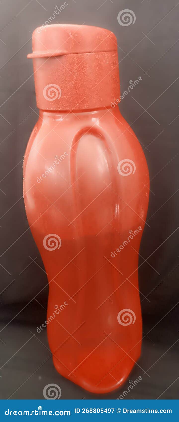 Red Water Bottle Against Black Background. Stock Image - Image of ...