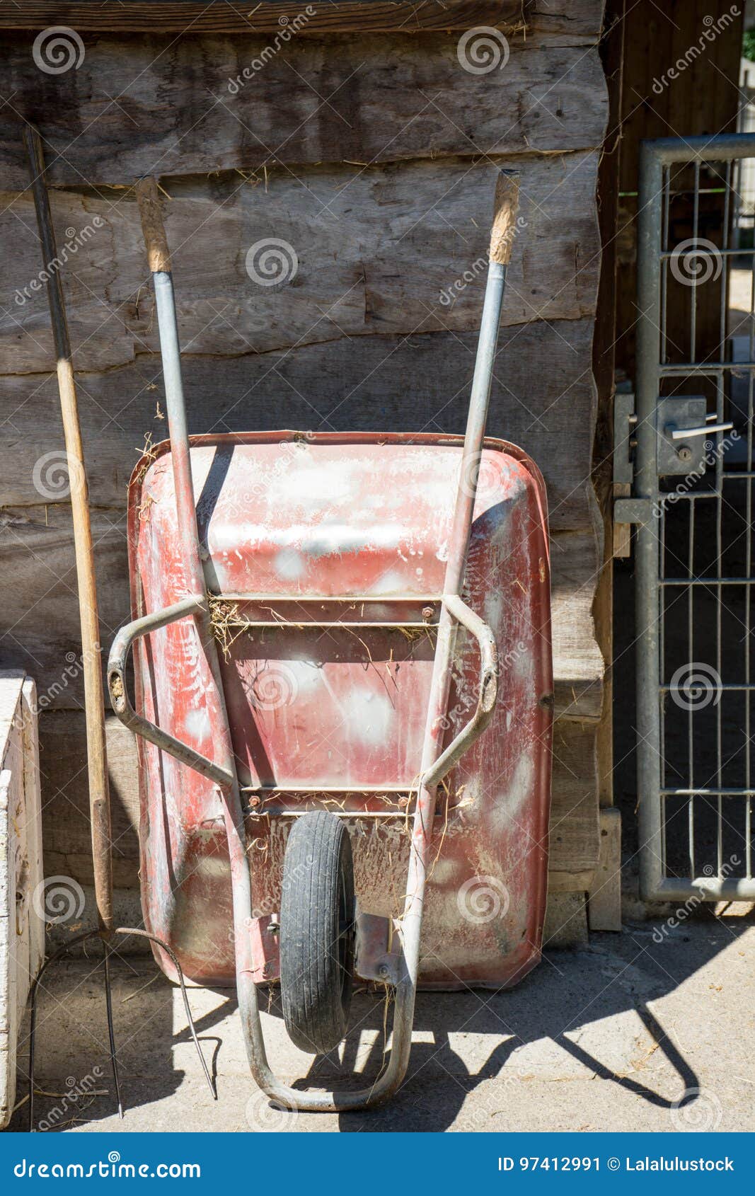 Red Wheelbarrow Standing Outside the Stable Stock Image - Image of ...