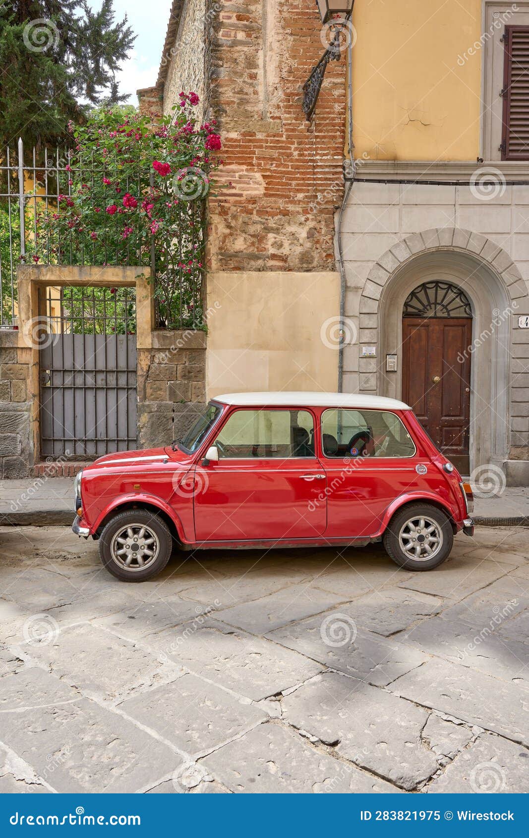 Red and White Automobile Parked in Front of an Iconic Italian Building ...