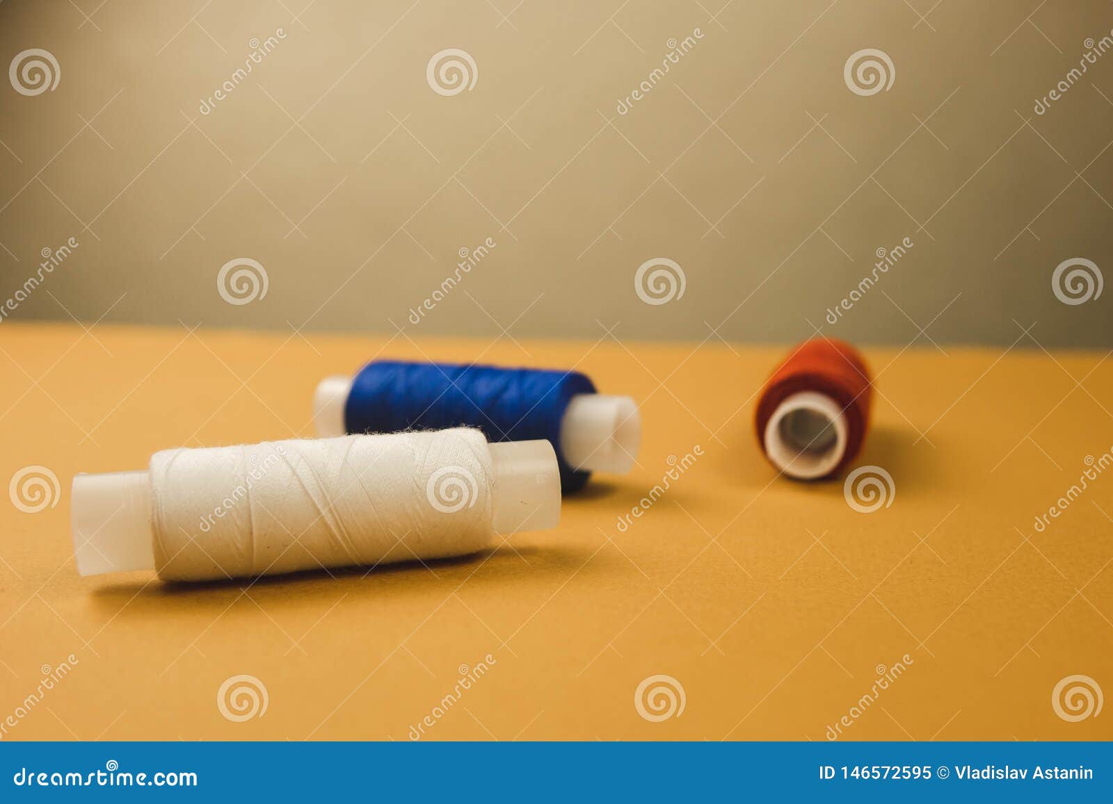 Red White and Blue Threads on an Orange Background Stock Image - Image ...