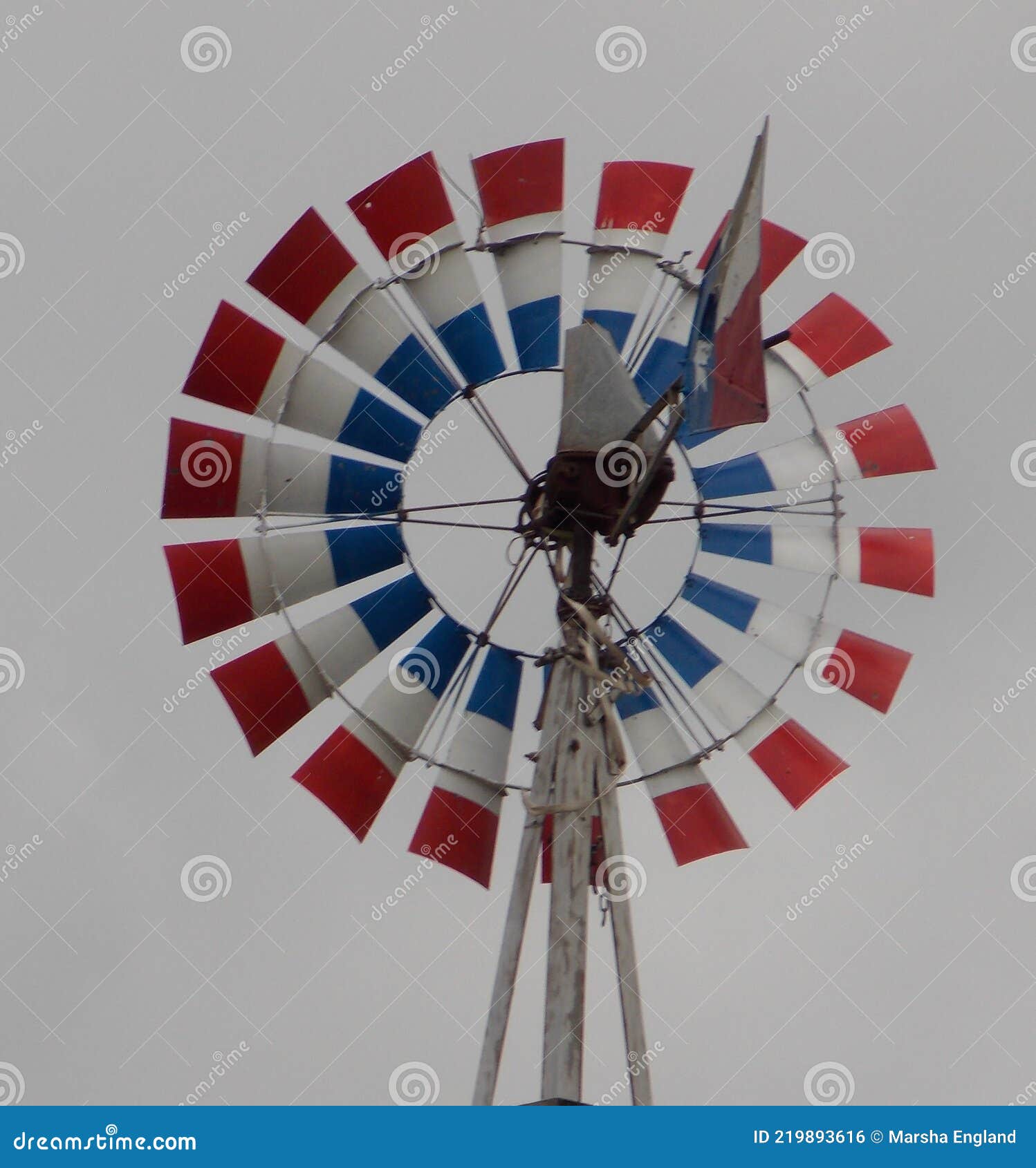 Red, White, and Blue Windmill Stock Photo - Image of central, rural ...