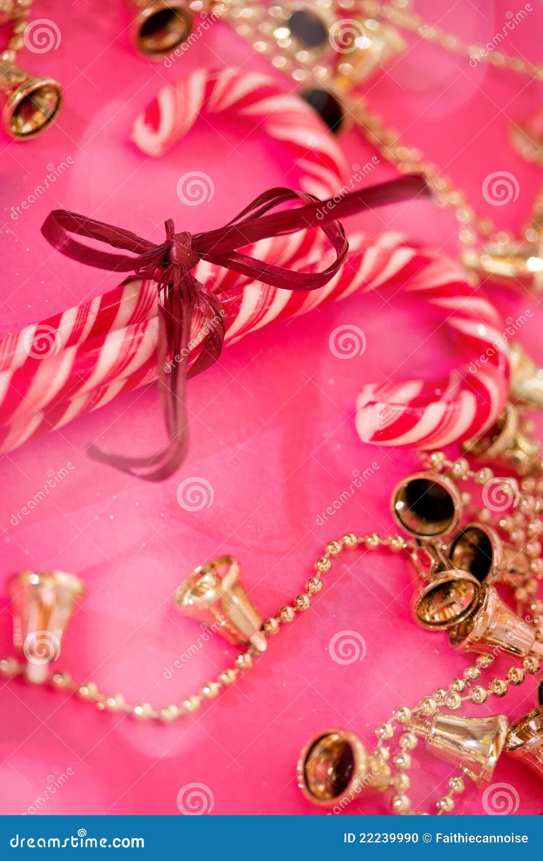 Red and White Christmas Candy Canes on Pink Stock Photo - Image of pink ...