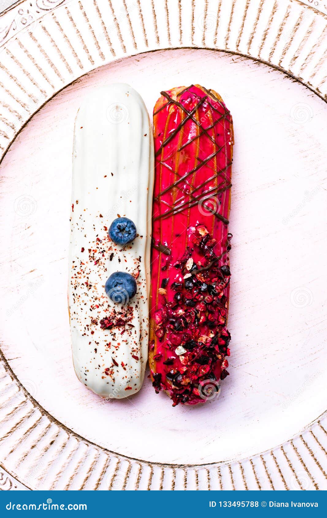 Red and White Eclairs on White Plate Stock Photo - Image of chocolate ...