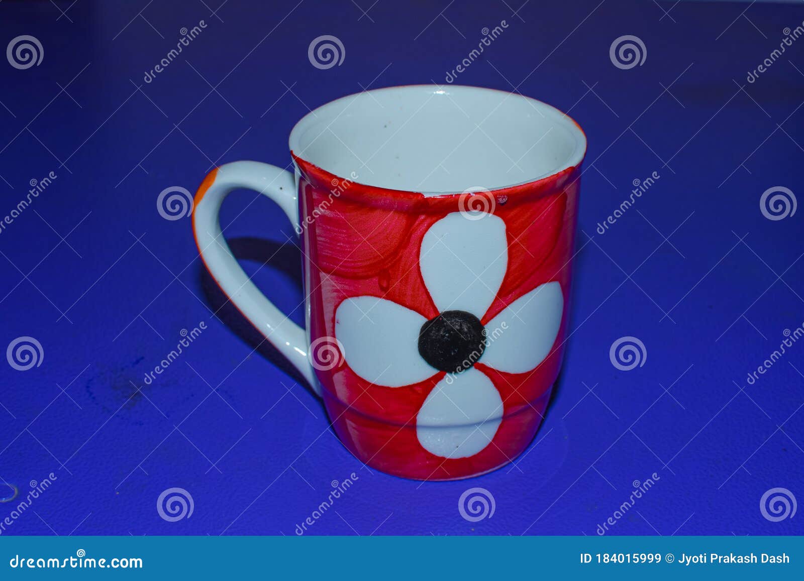Red & White Empty Tea Cup on Blue Background. Stock Image - Image of ...