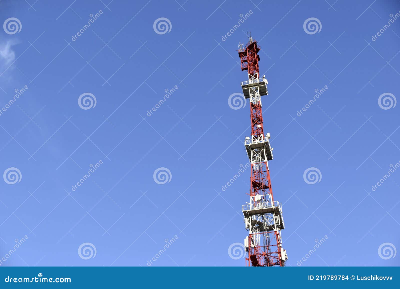 Red and White High Rise Communication Tower Antenna in the City with ...