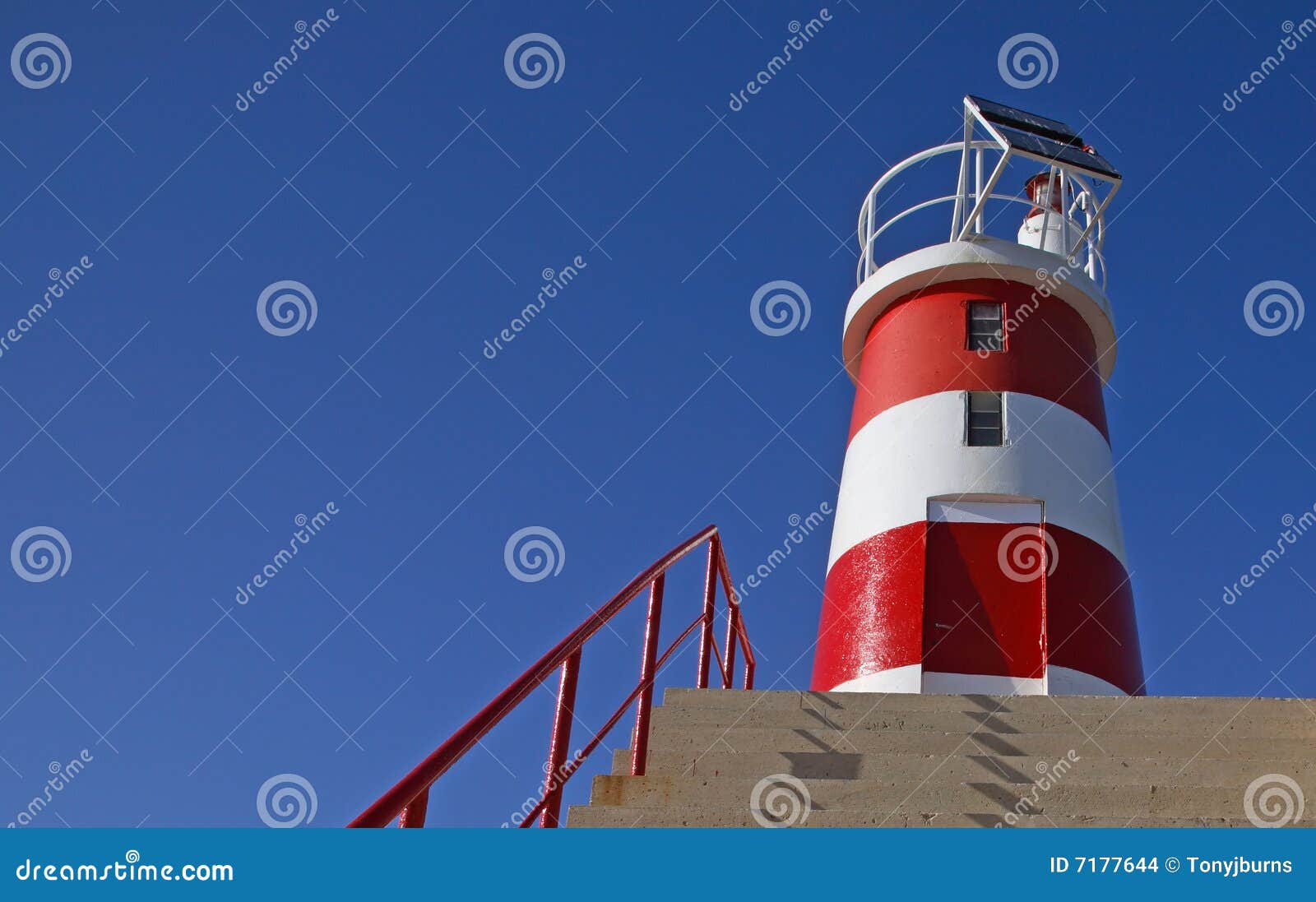 Red and white lighthouse stock photo. Image of blue, lighthouse - 7177644