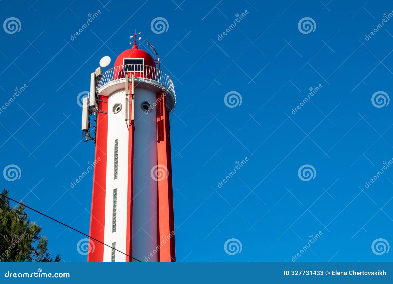 Red and White Lighthouse on a Background of Blue Sky in the Summer ...