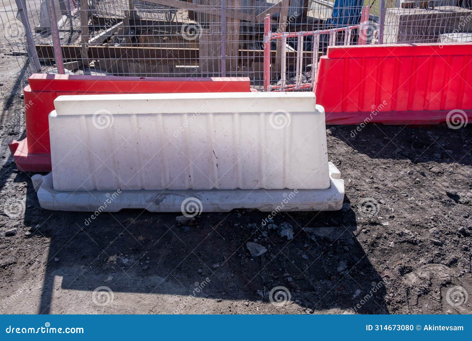 Red and White Plastic Barriers Enclose a Dug Pit for Construction and ...