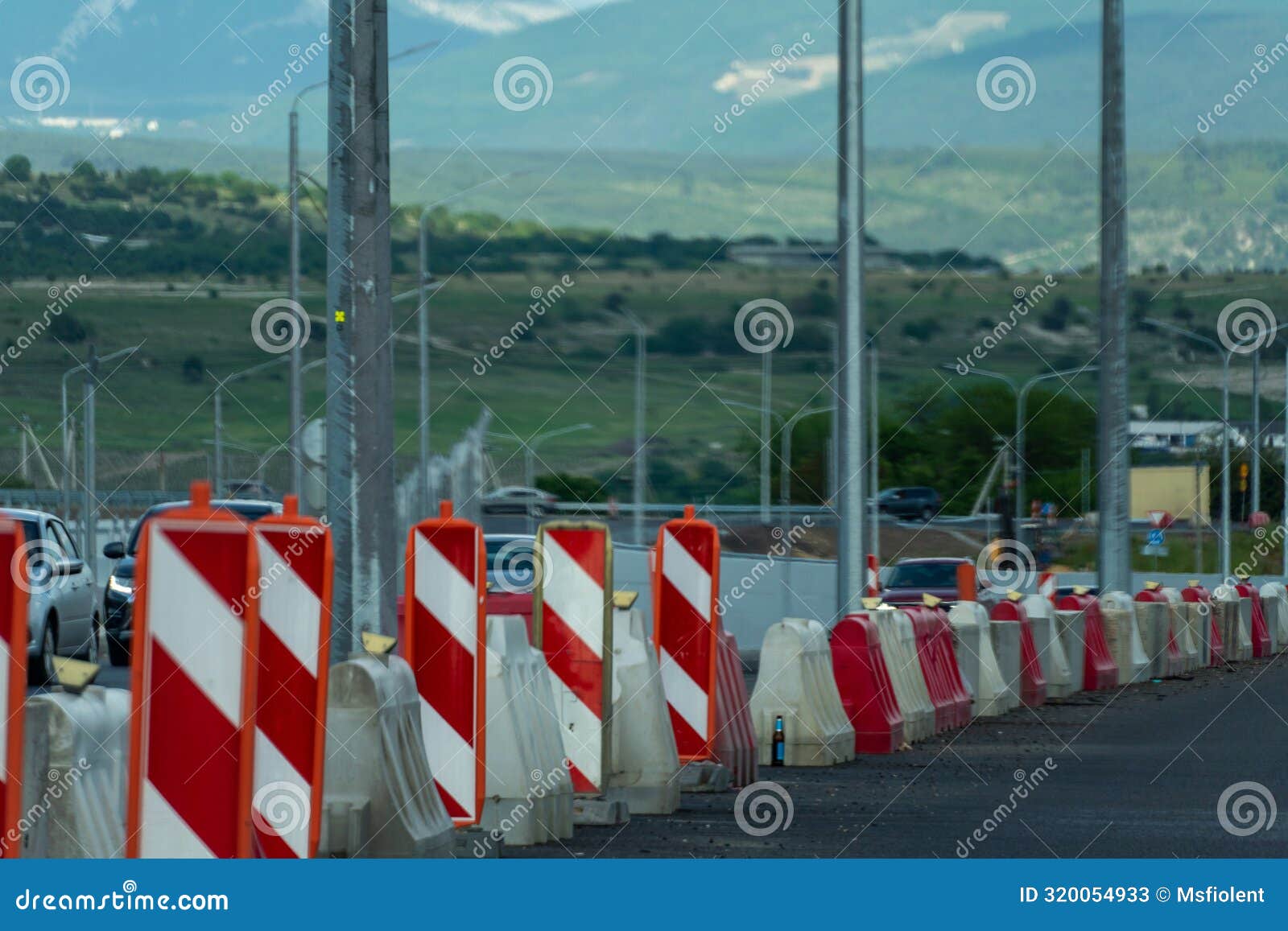 Red, White Plastic Safety Barriers Along Road. Ensuring Road Safety ...