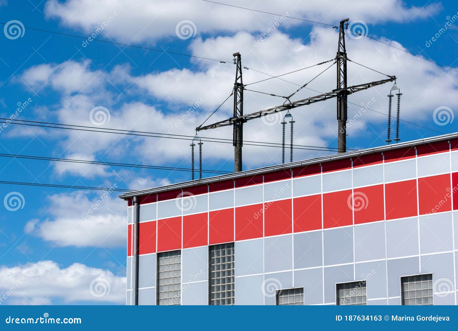 Red and White Power Station. into a Clear Blue Sky with a High Voltage ...