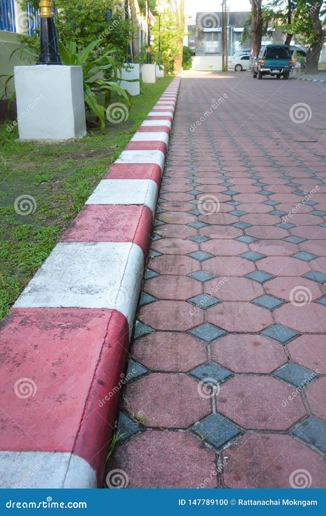 Red and White Road Marking on the Sidewalk Stock Photo - Image of ...