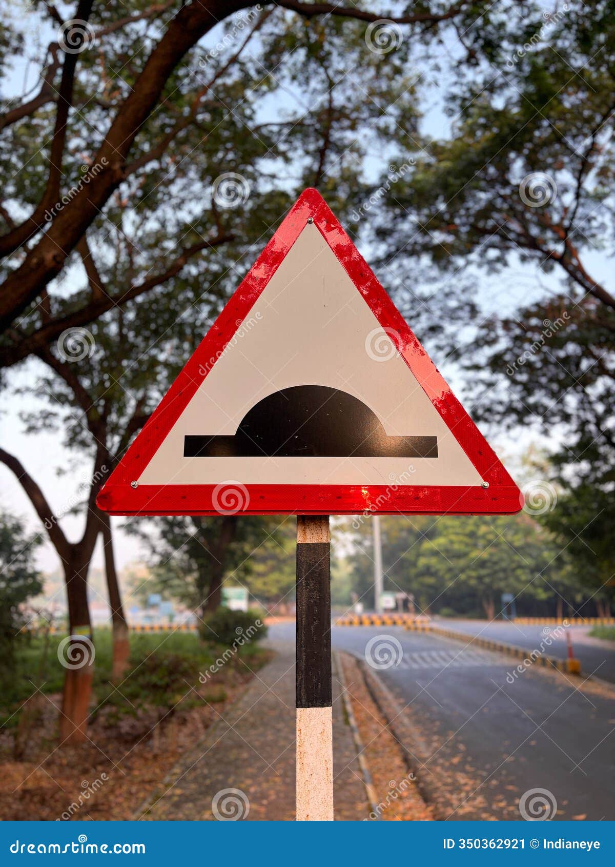 A Red and White Sign with a Black Triangle on it Stock Image - Image of ...