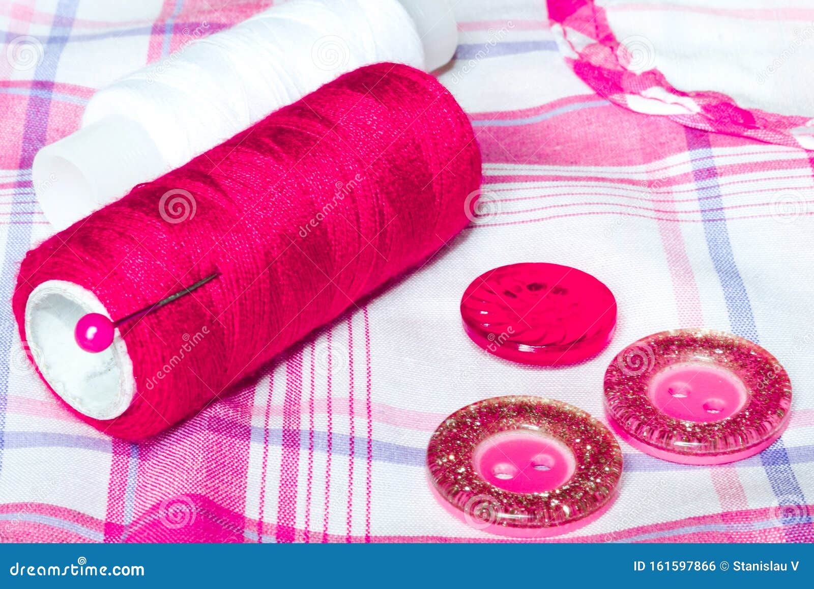 Red and White Thread and Buttons on a Checkered Cloth. Sewing ...