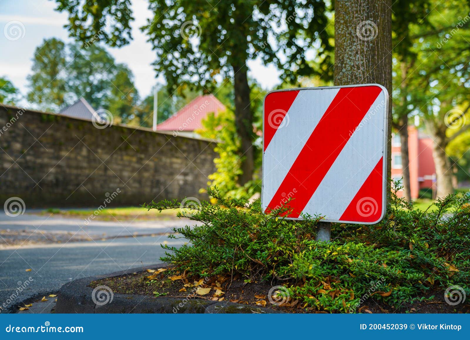 Red and White Warning Sign in Front of an Obstacle on the Road Stock ...
