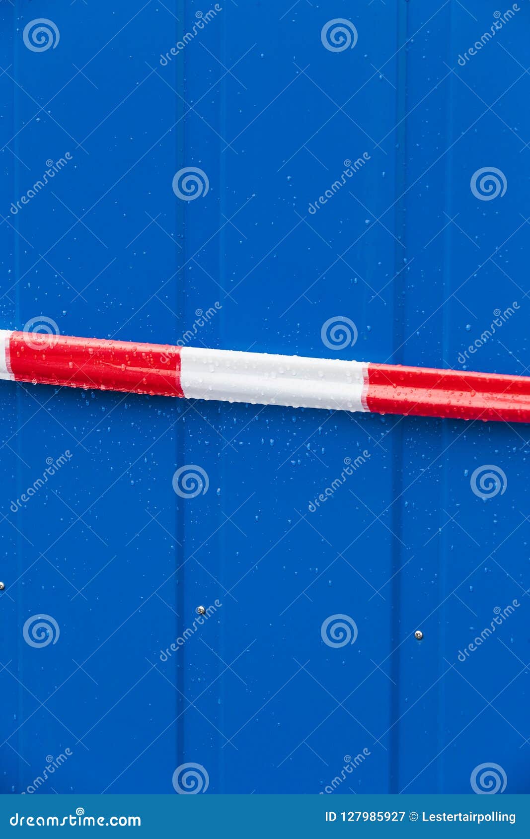 Red and White Warning Tape on a Blue Steel Stock Image - Image of ...