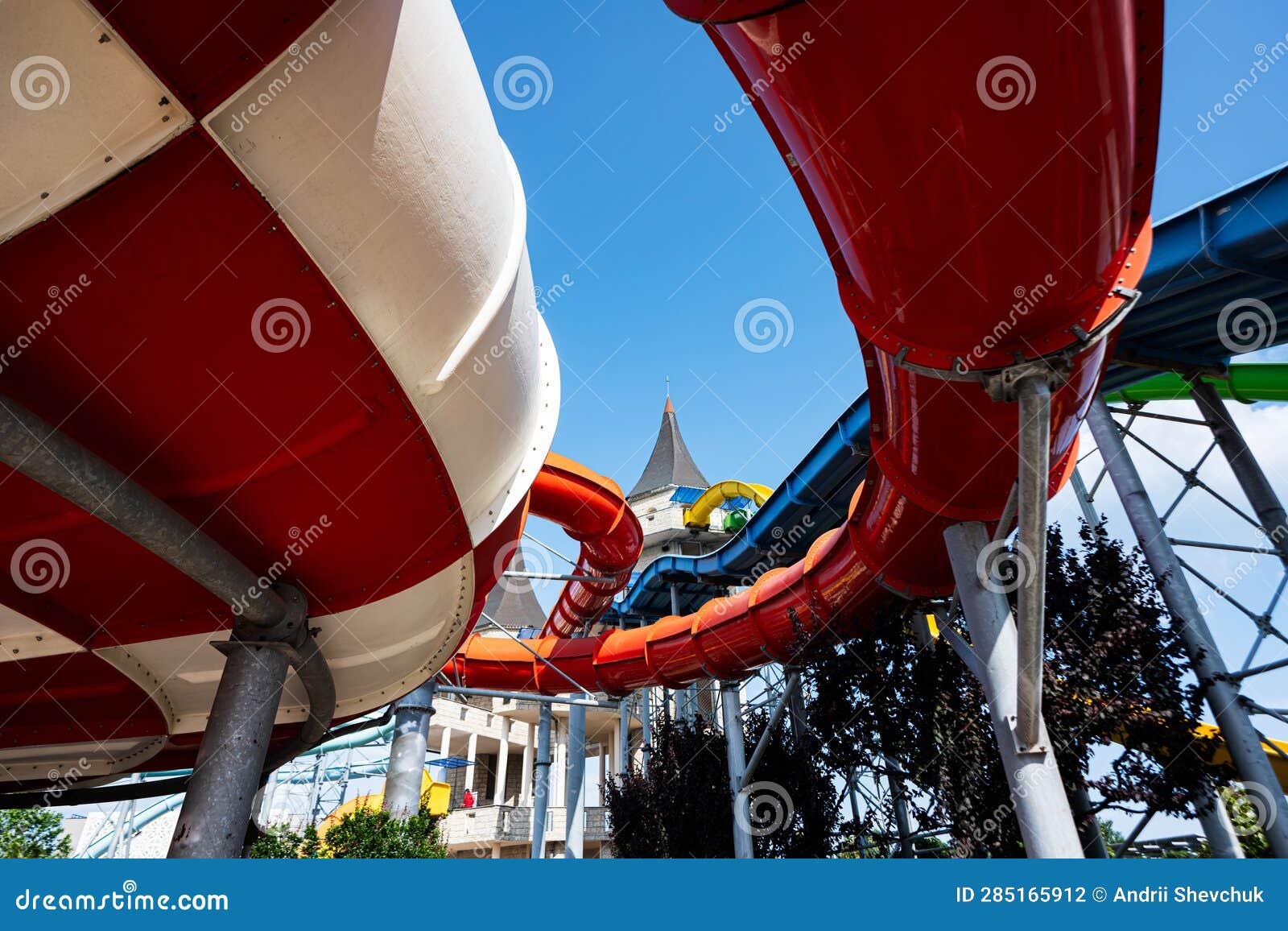 Red and White Water Slides in an Amusement Park on a Sunny Day Stock ...