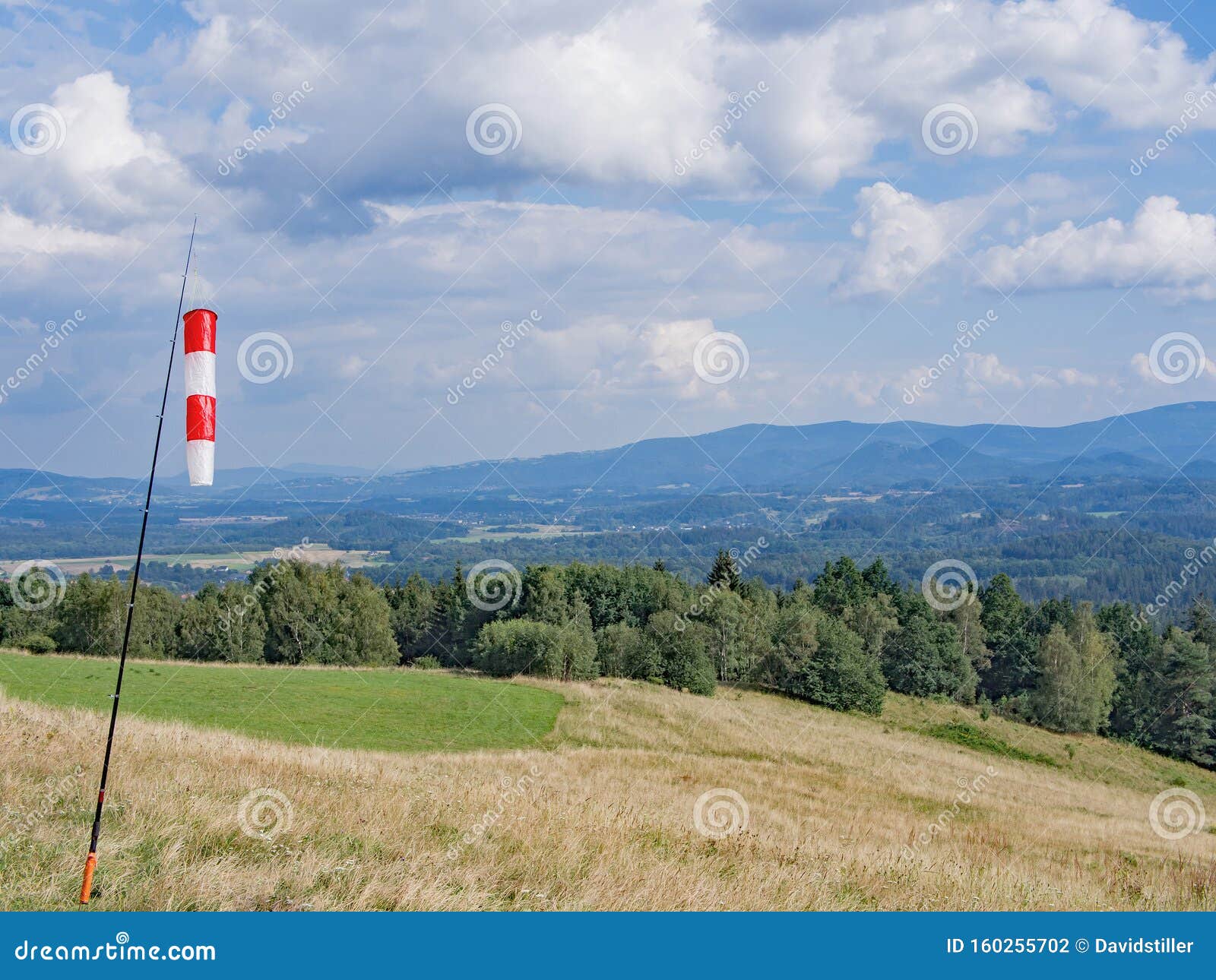 Red and White Wind Cone in a Hilly Landscape with Forest Stock Photo ...