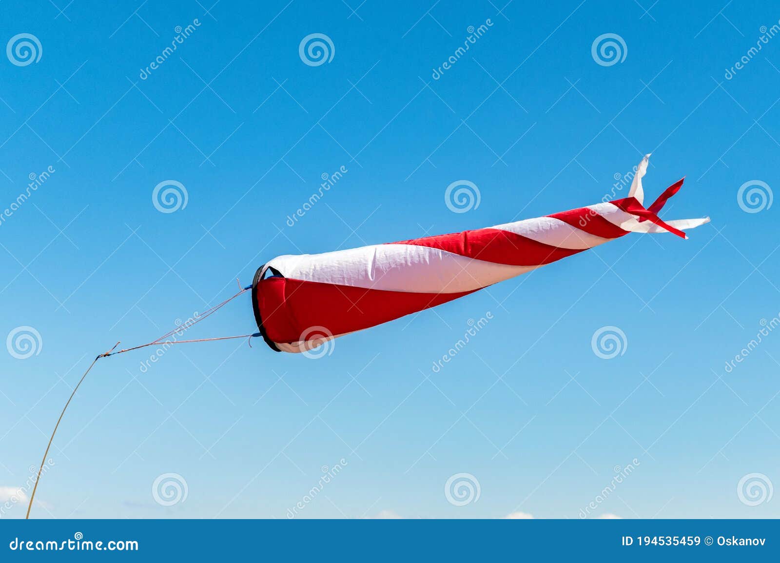 Red and White Windsock on a Background of Blue Sky Stock Image - Image ...
